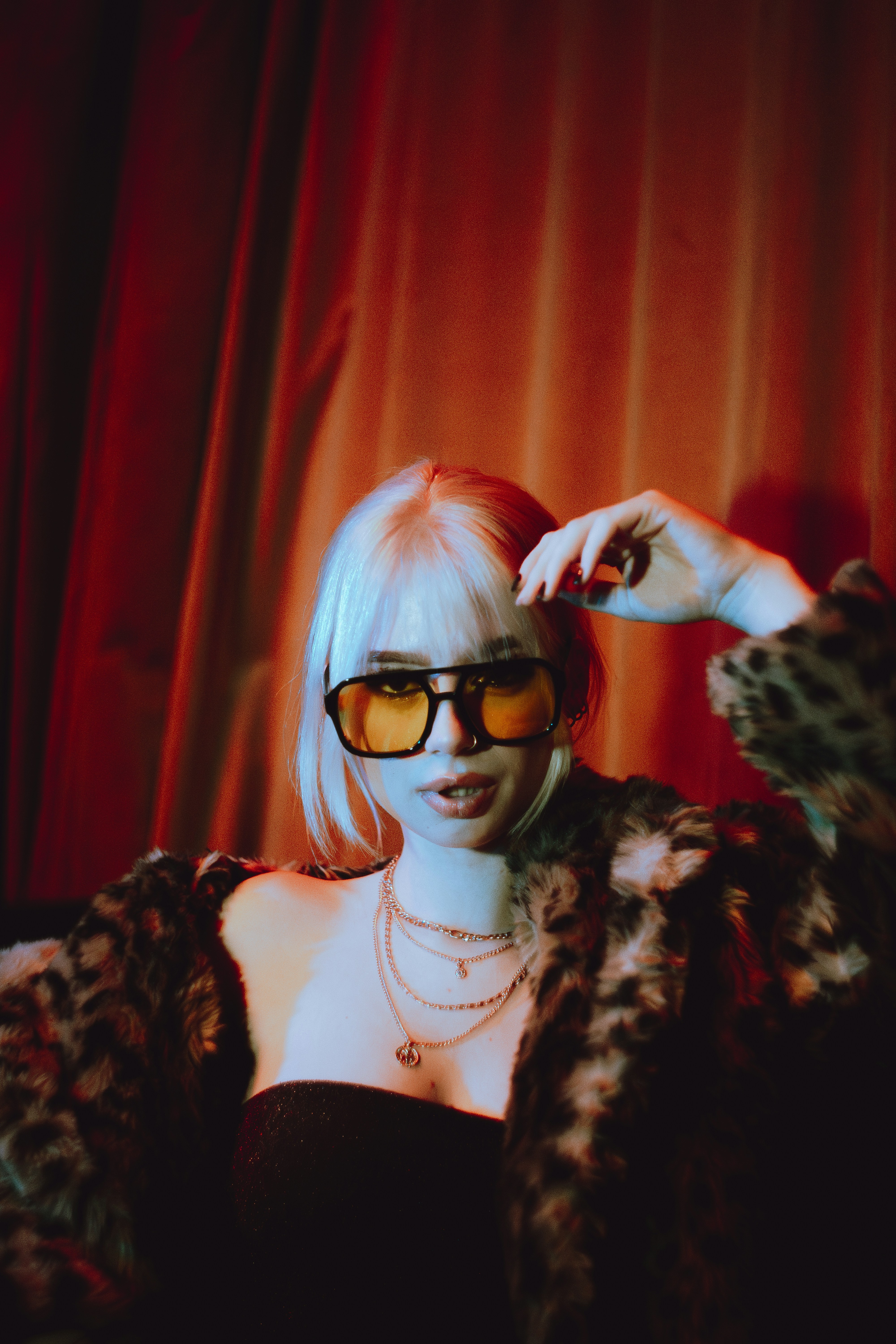 Neon Velvet: A Bold Glare Beneath Amber Curtain