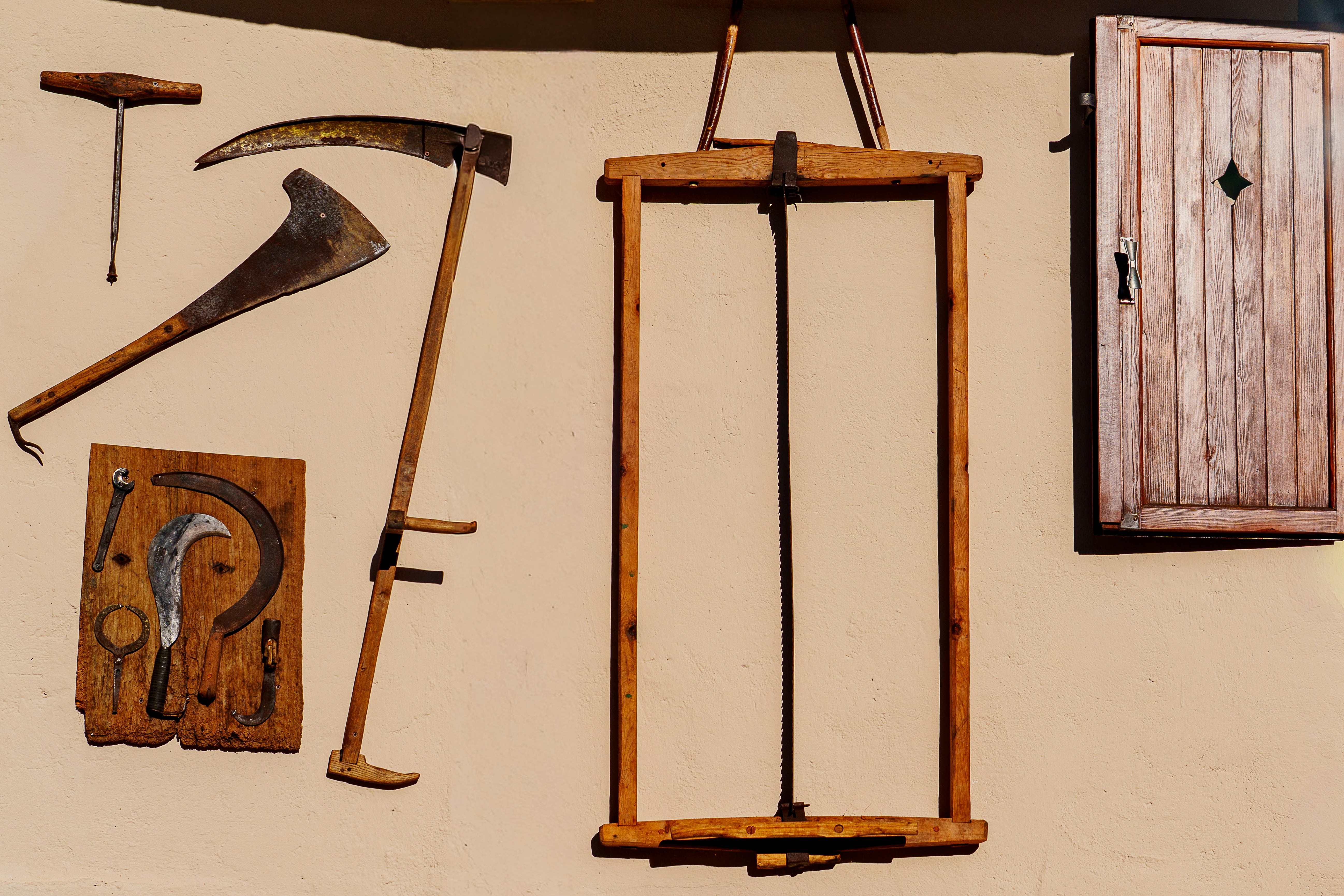 Wall of Tools: A Rustic Gallery of Handcrafted Iron and Wood