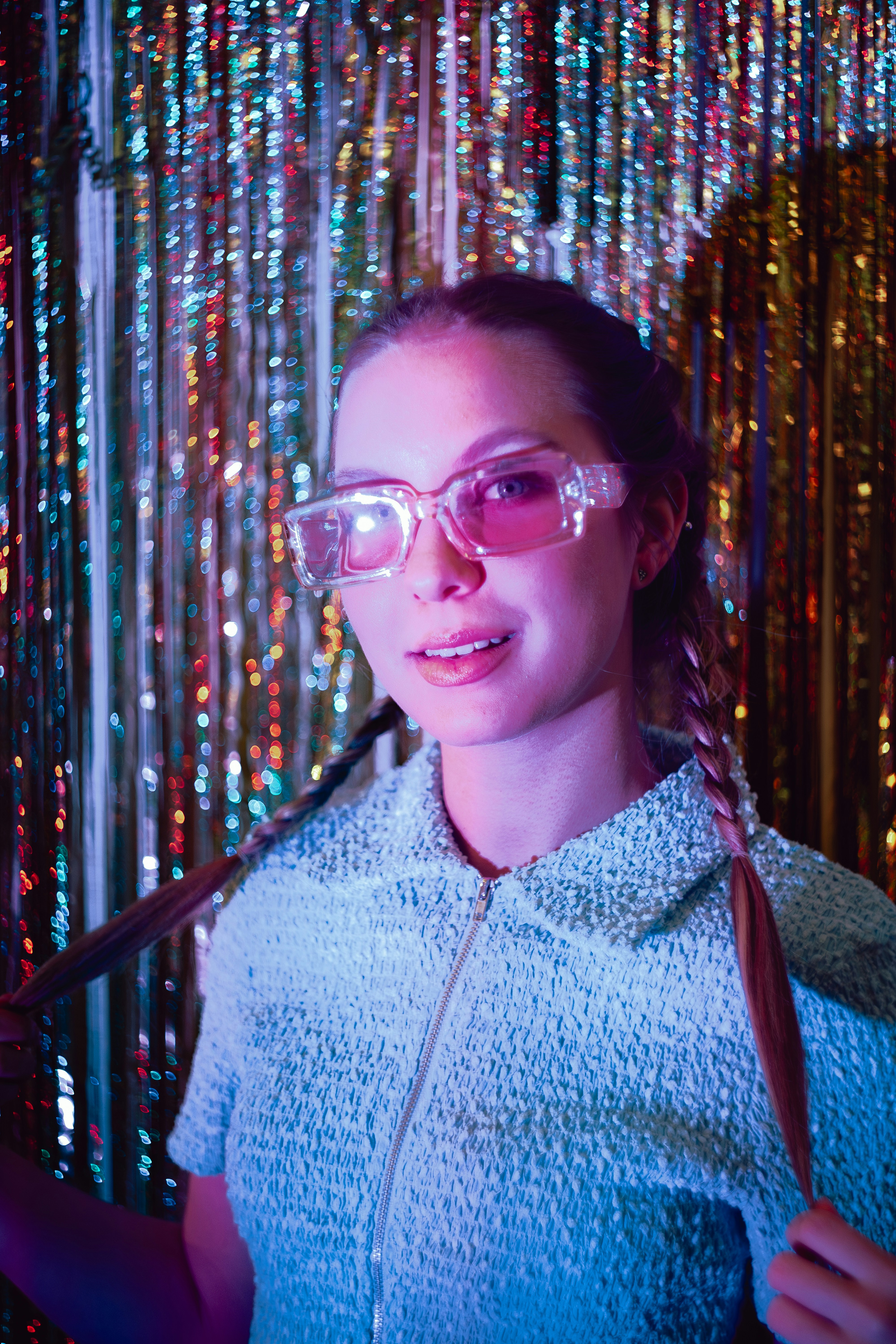 Neon Portrait Under Glittering Curtains