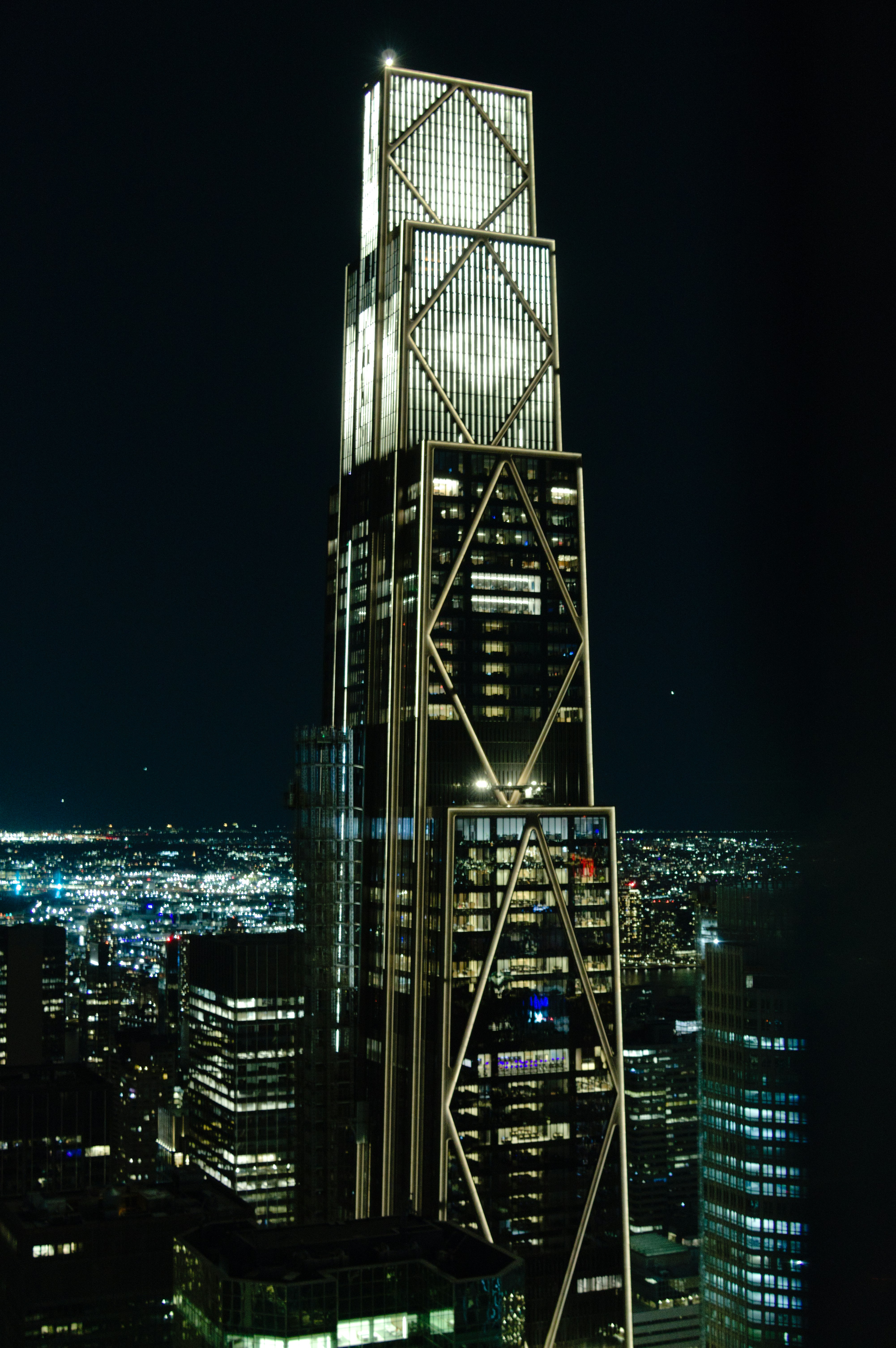 Neon Skeleton: The Night Tower Looms Over a City
