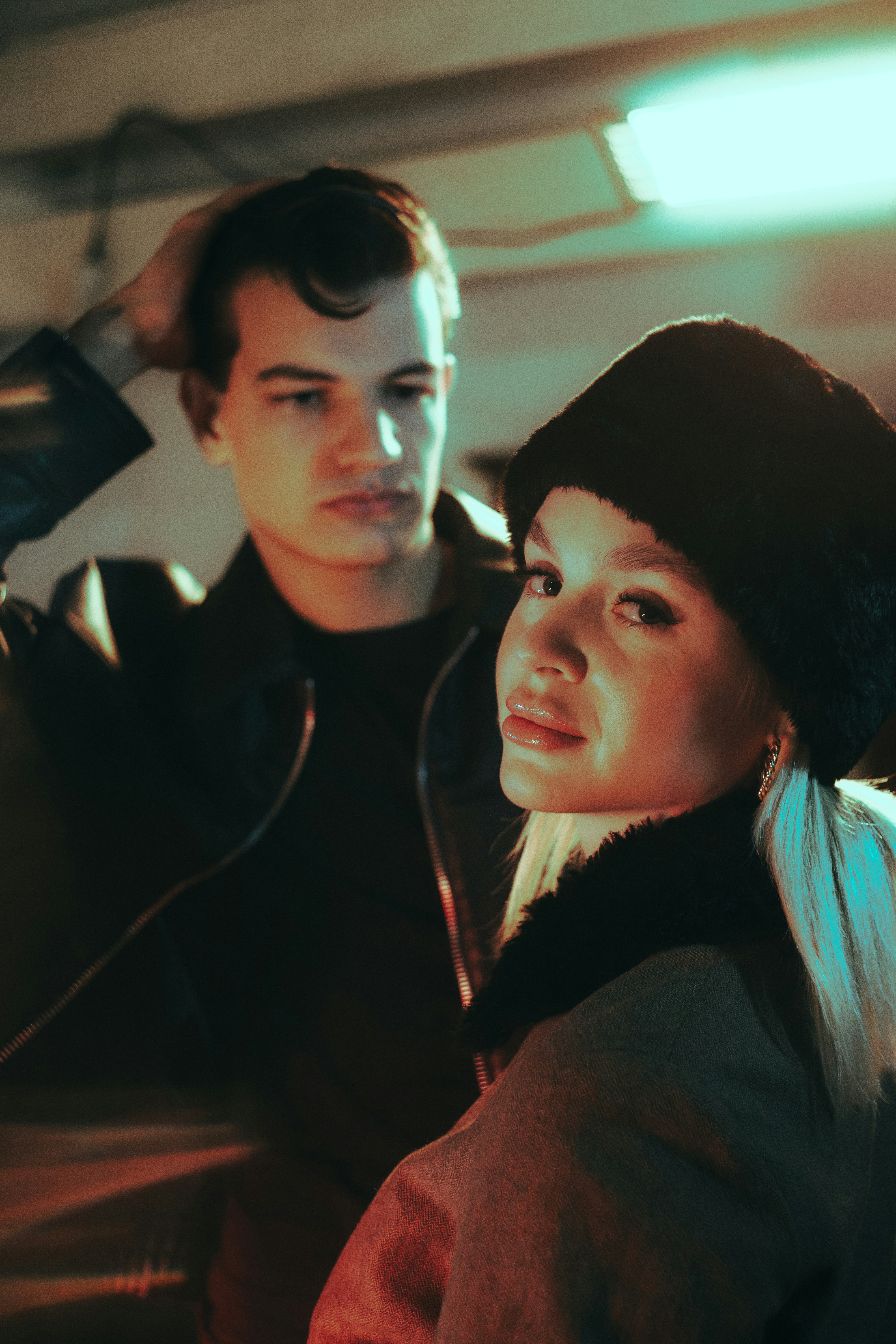 Neon Night Confidants in a Shadowed Garage
