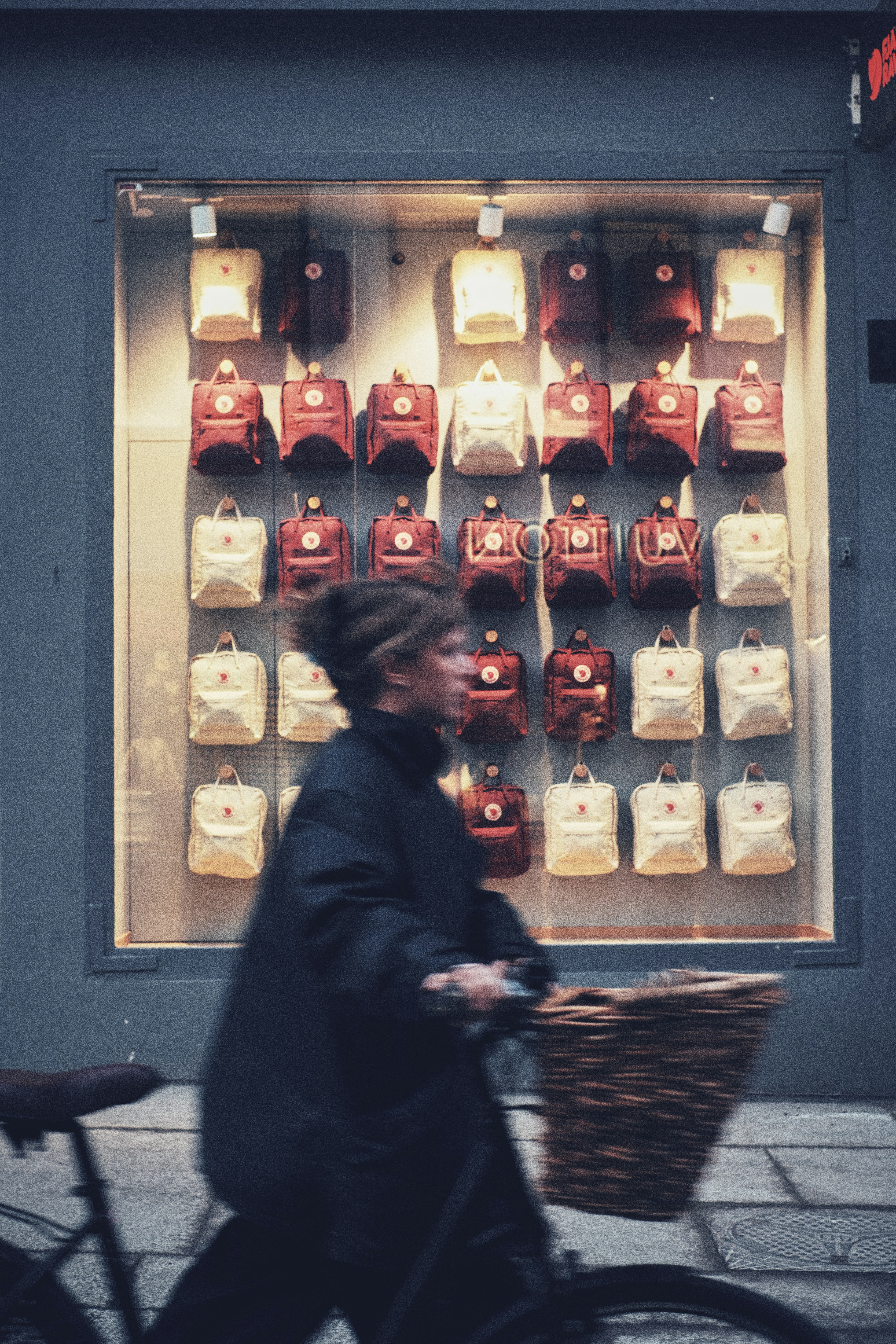 Motion in Front of a Wall of Backpacks