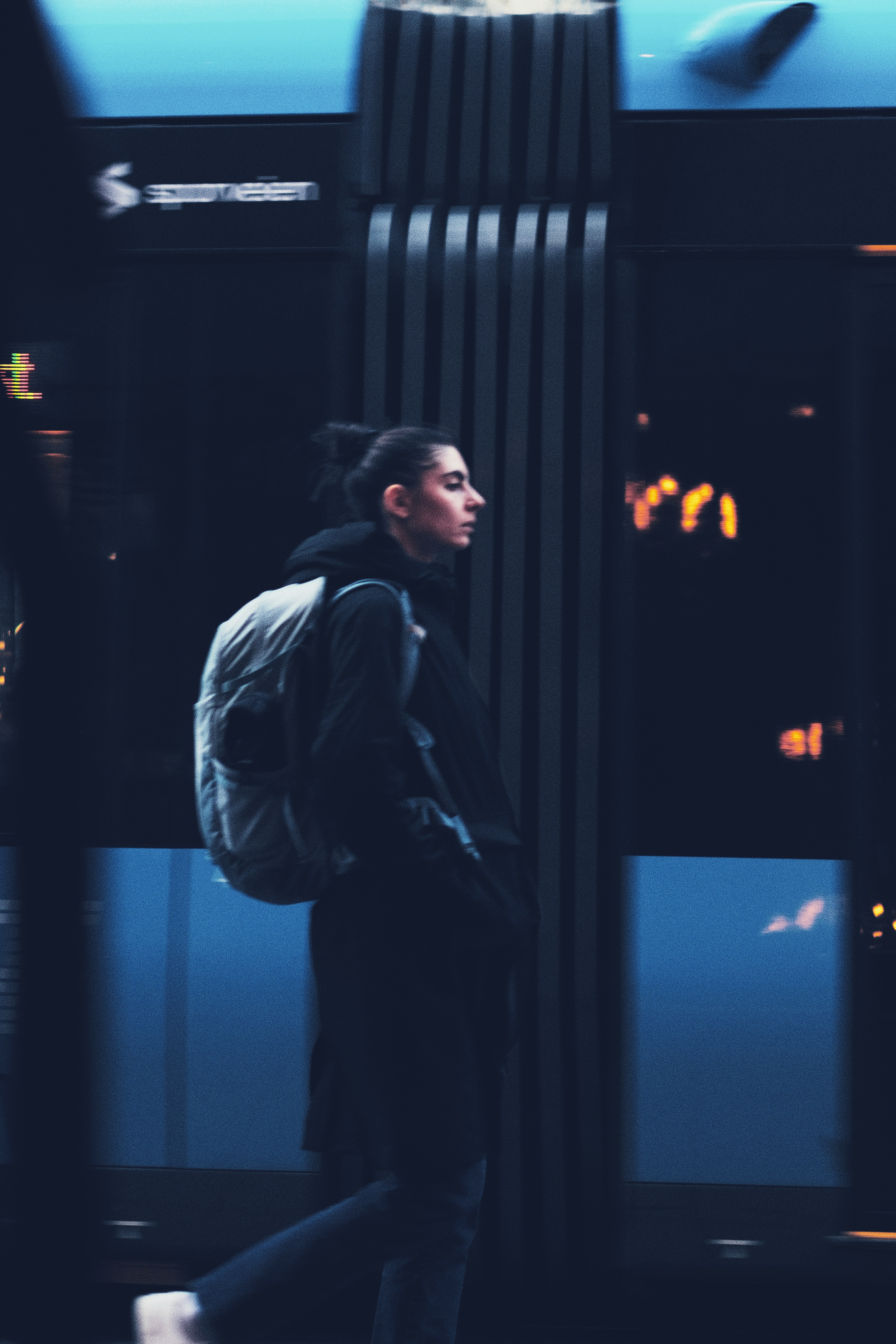 Traveler in Transit: A Quiet Moment on a Moving Platform