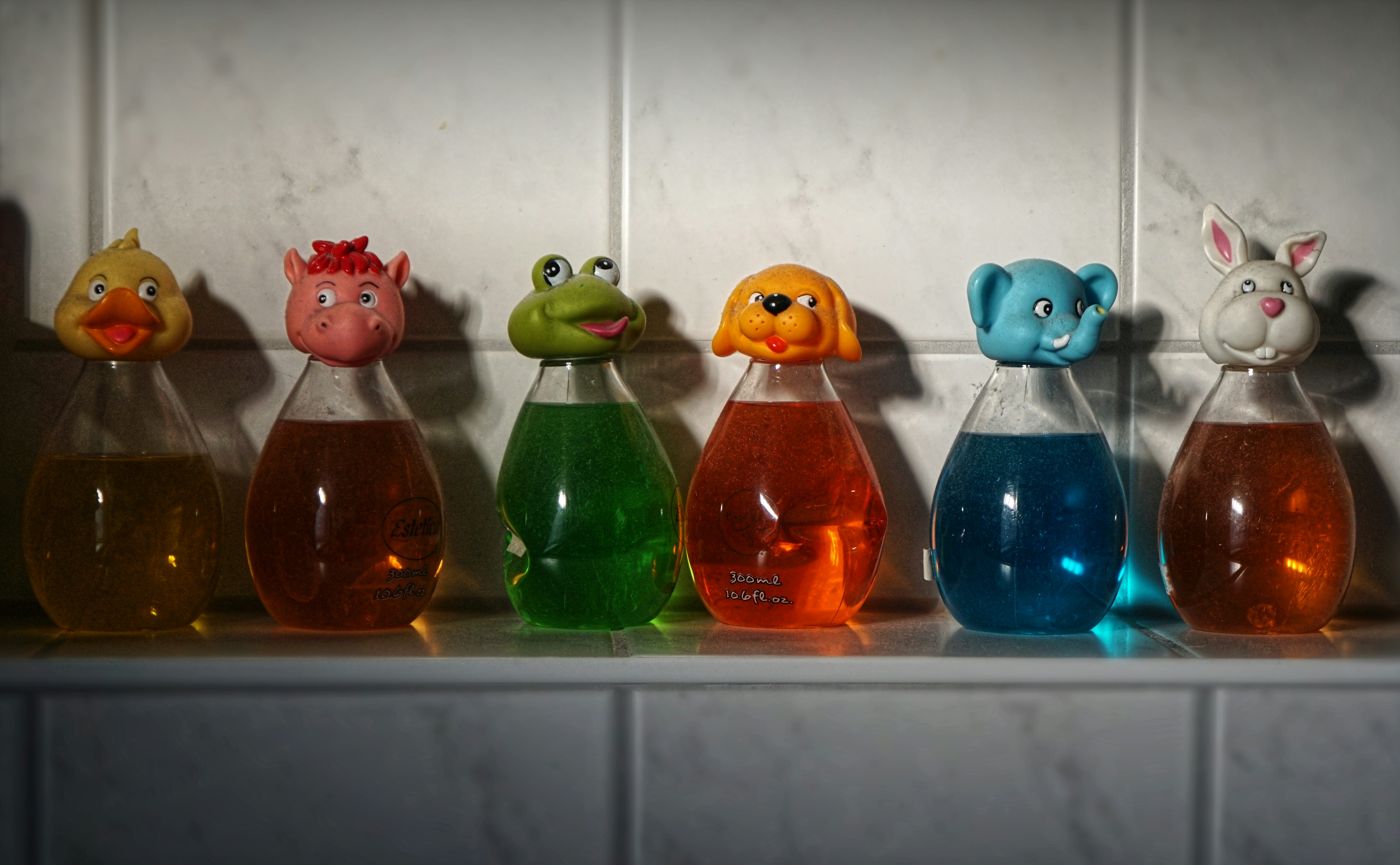 Colorful Toy Chickens in Necked Bottles on a Shelf