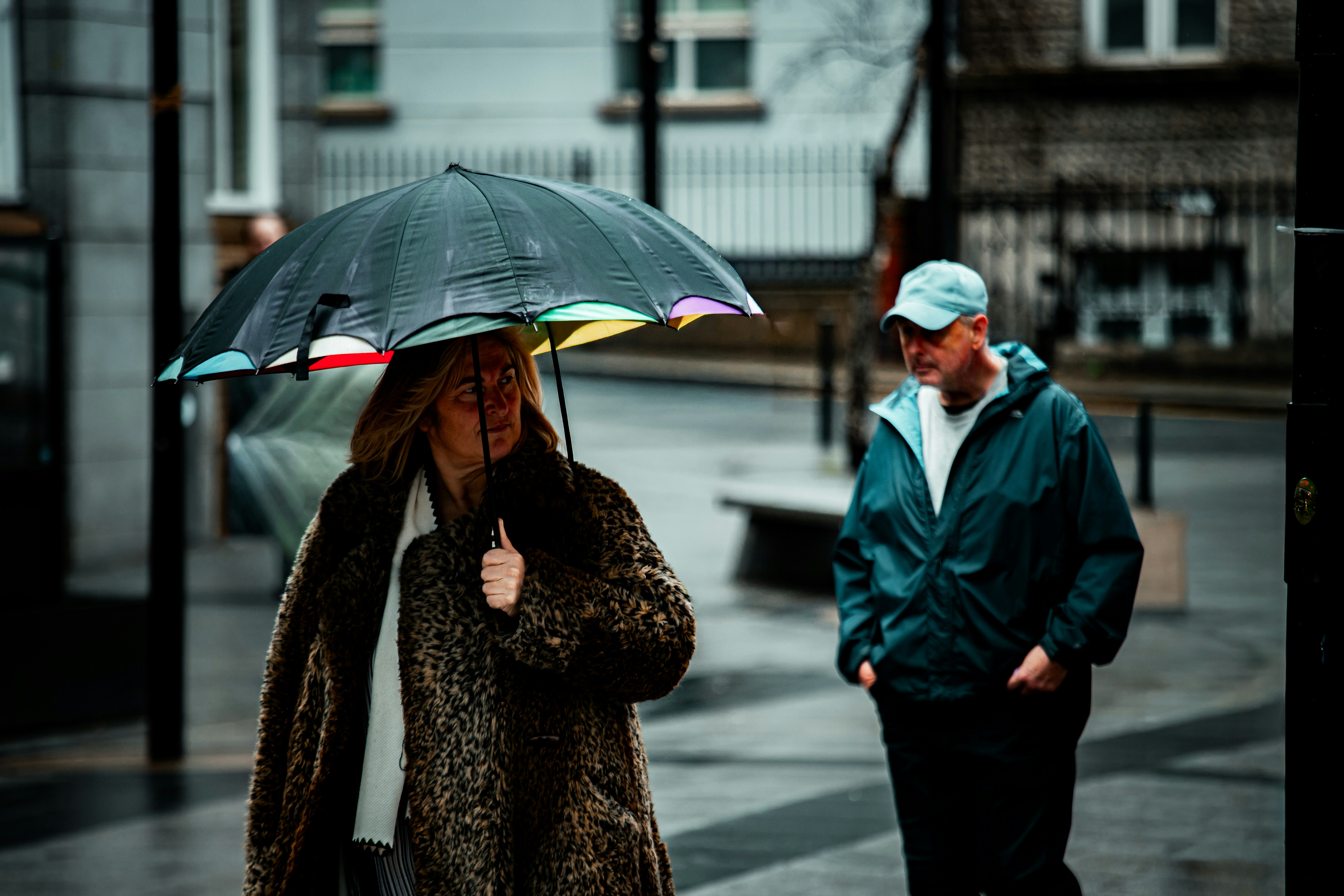 Umbrella in the Rain: A Quiet Street Scene
