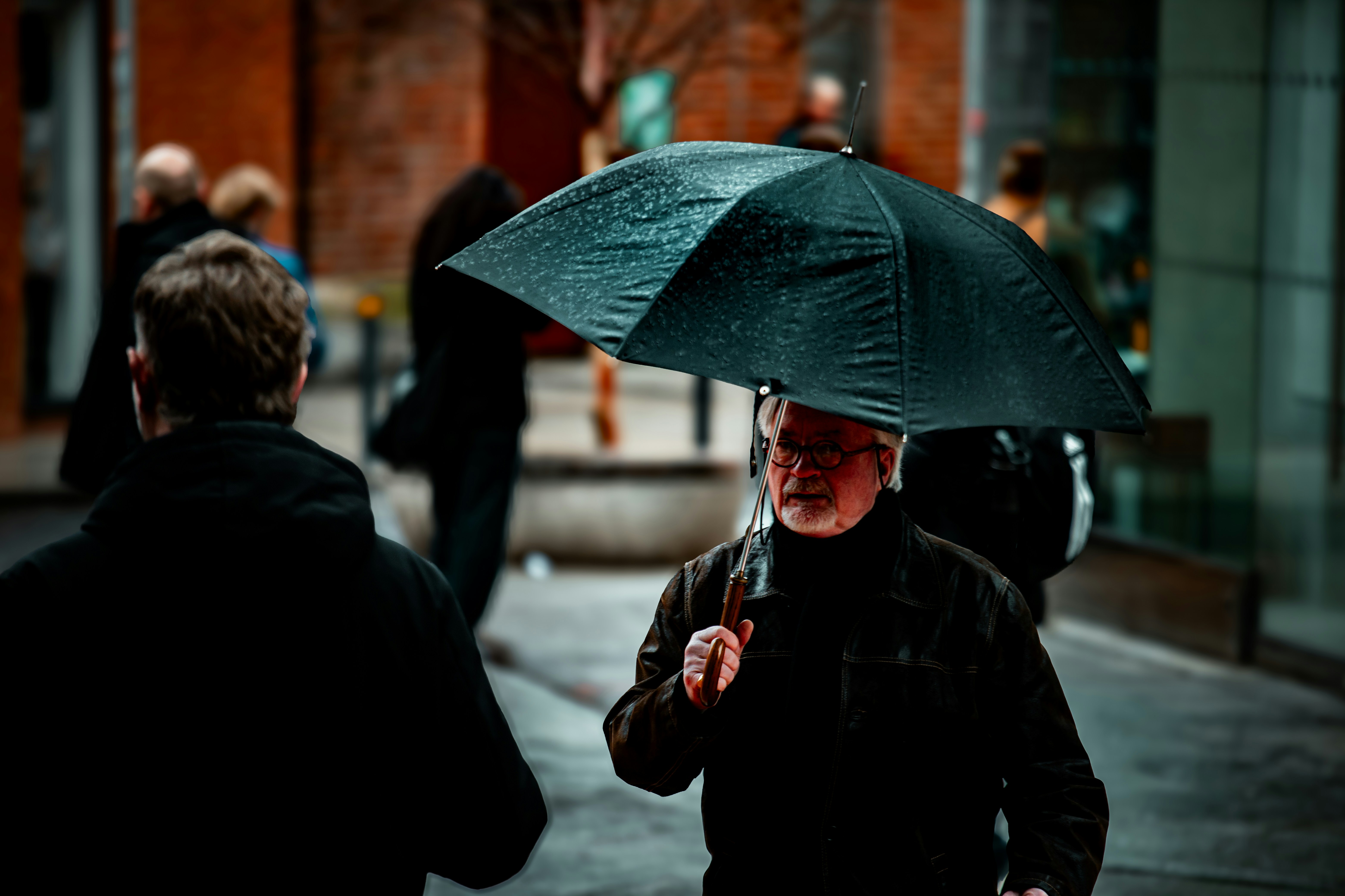Umbrella in the Rain: Portrait in a City Square