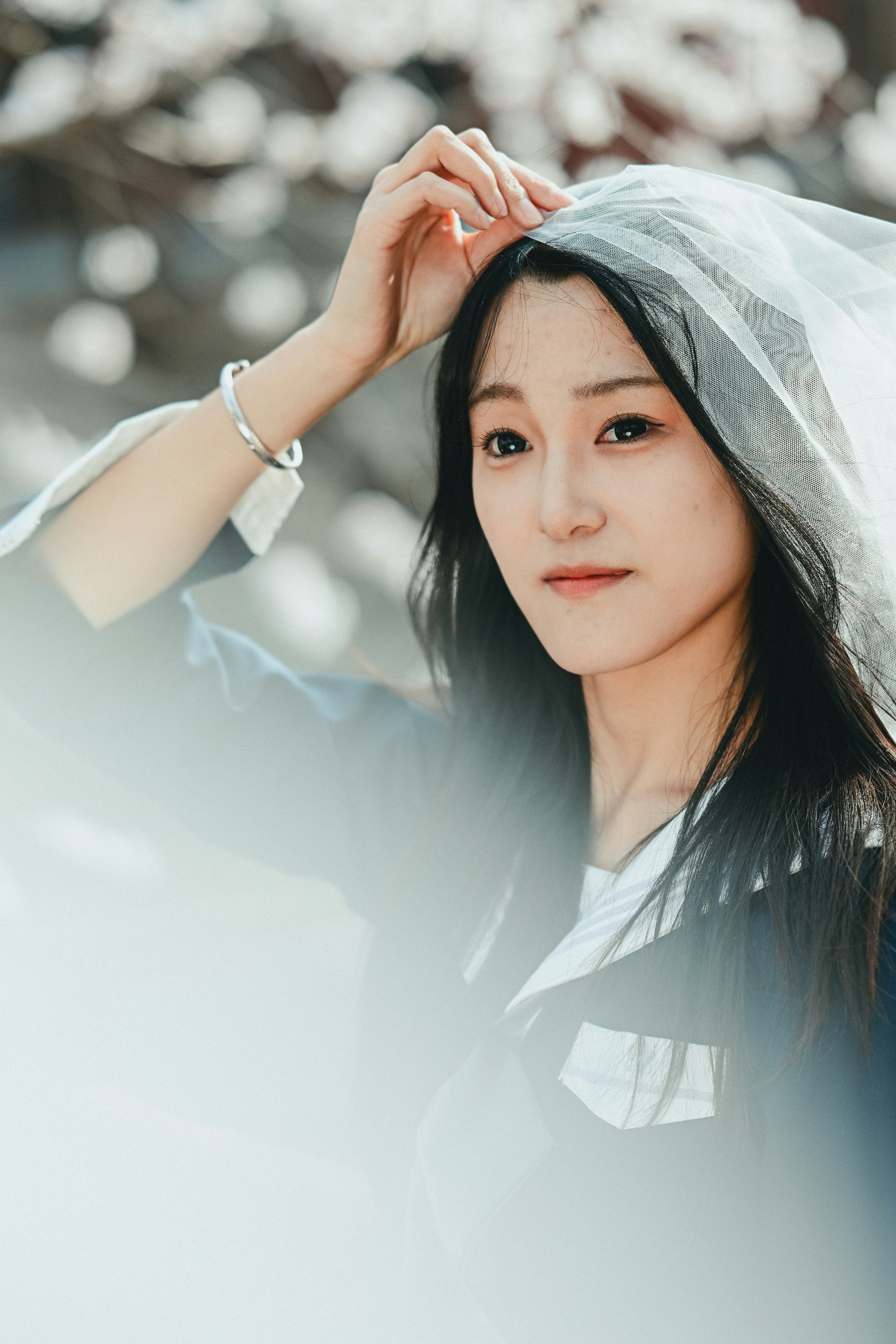 Veil of light: portrait under soft bloom