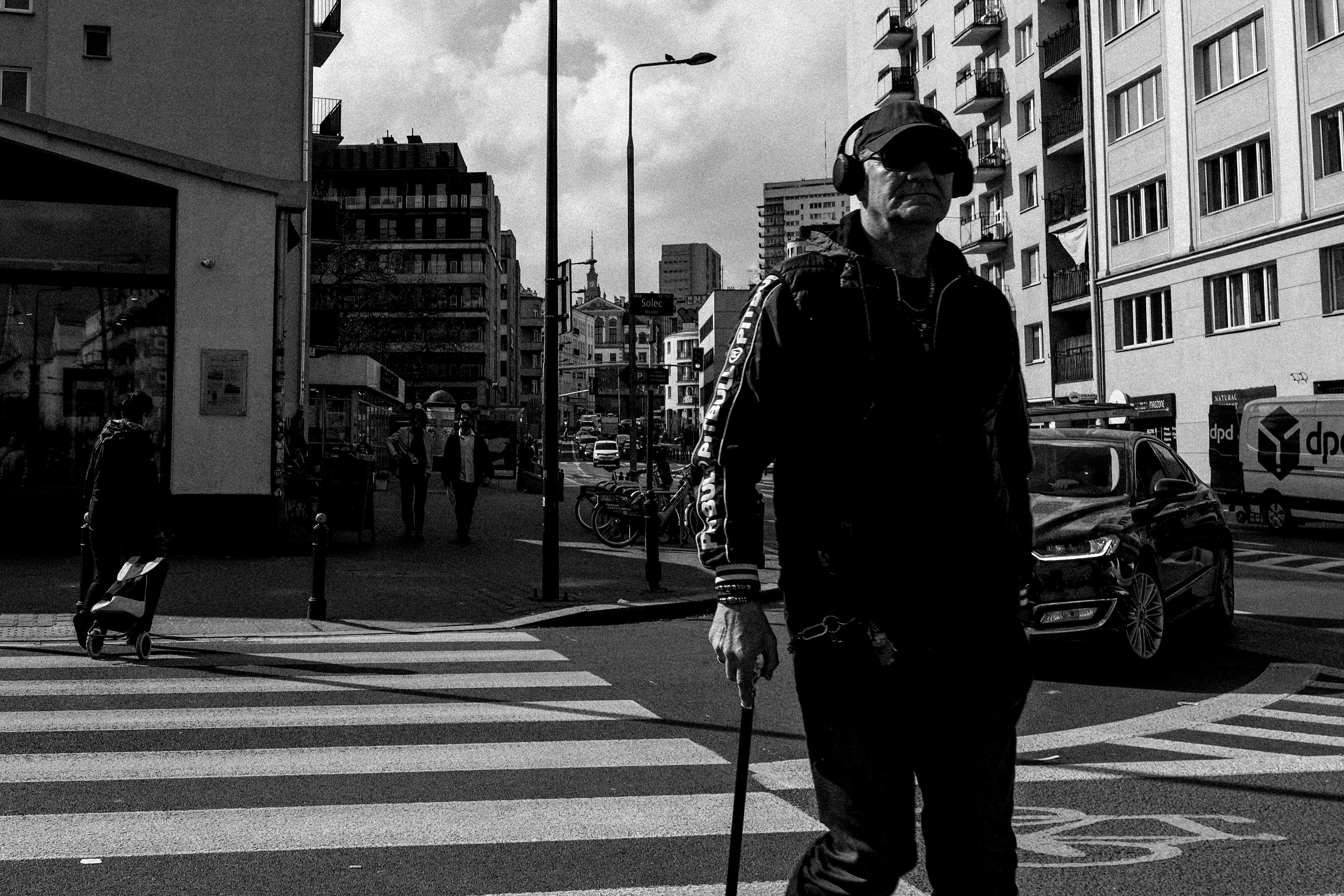 Urban Walker in a Monochrome Crosswalk