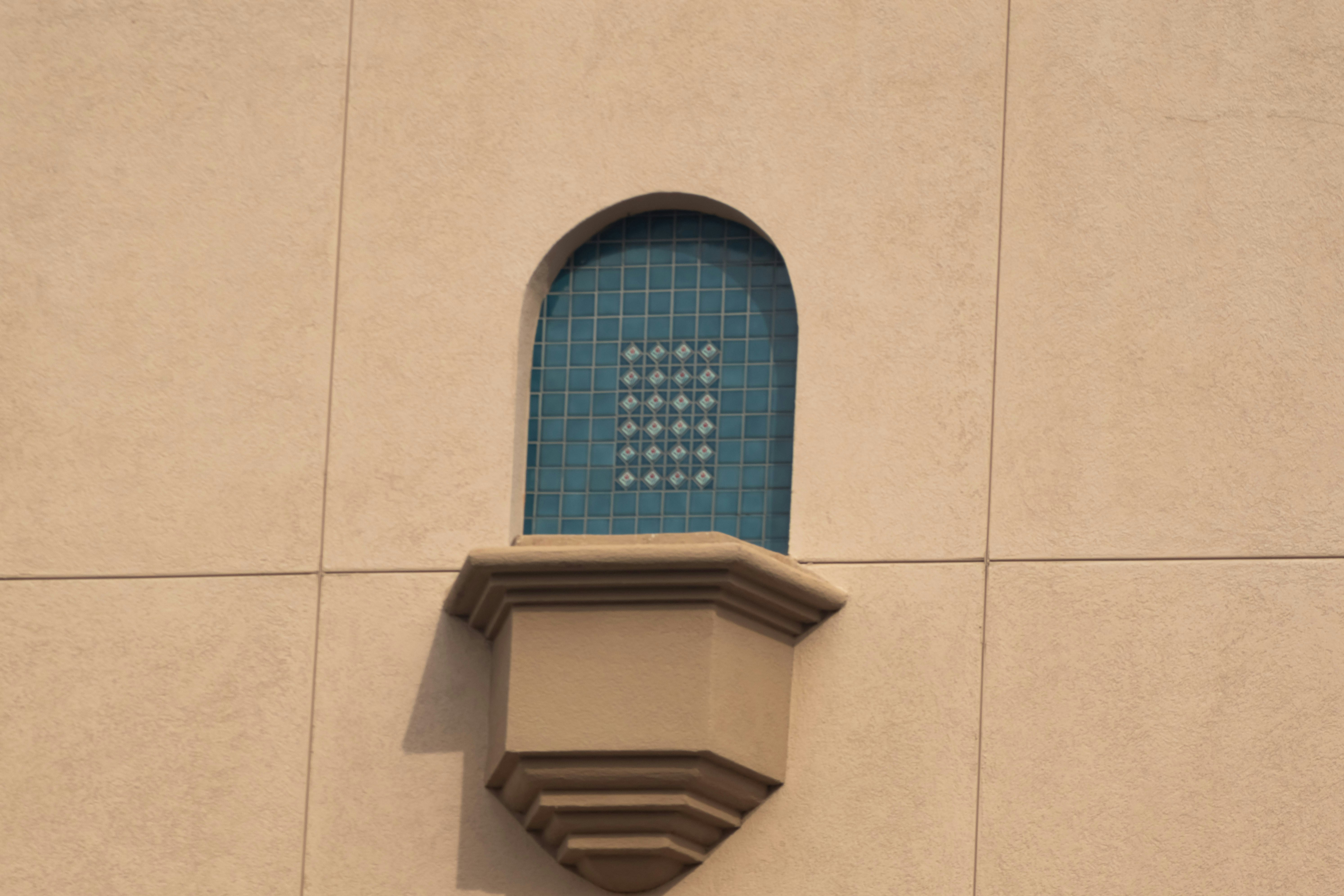 Architectural Niche: A Windowed Embellishment Amid Pale Facade