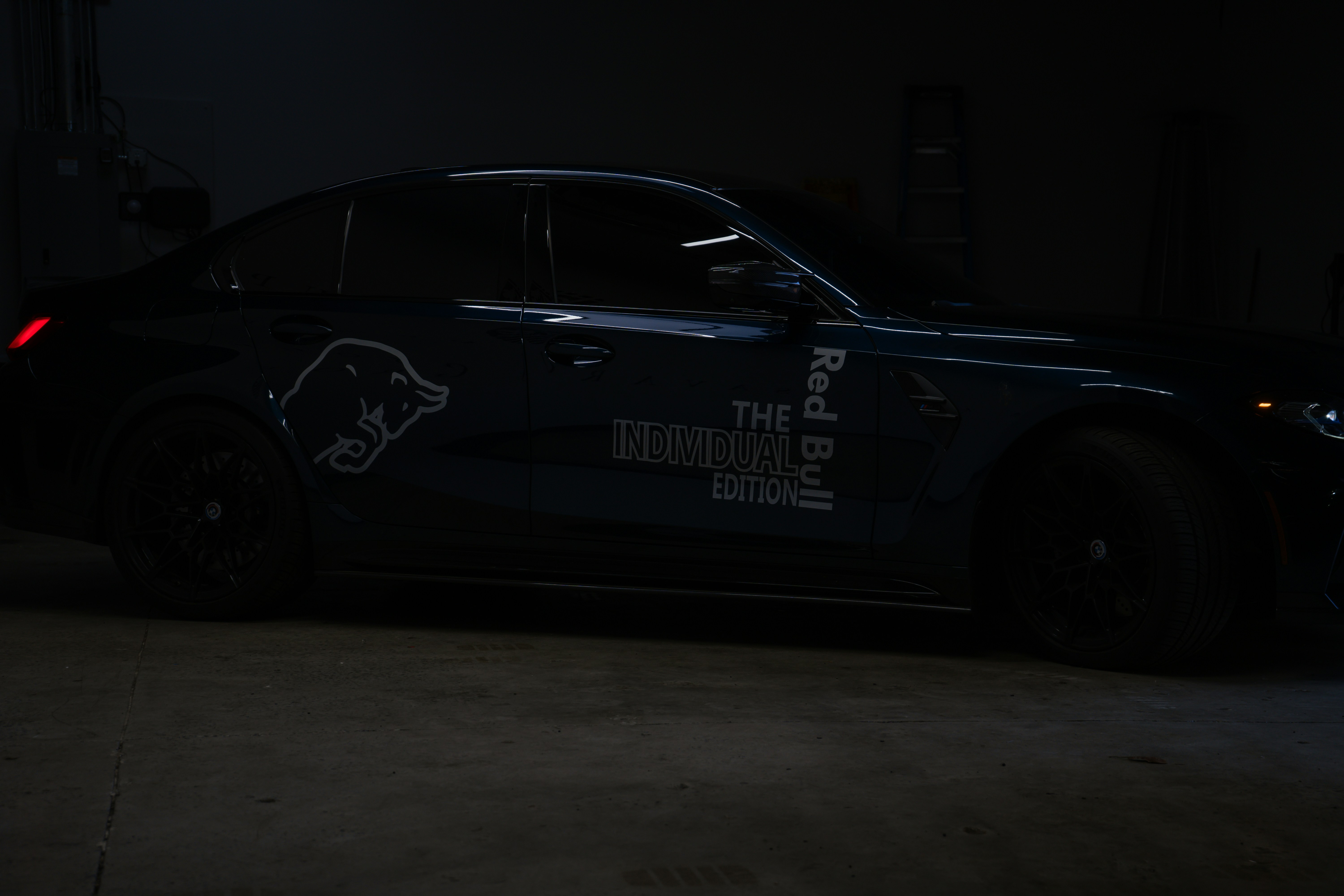 Secretive Night Run: A Dark Lamborghini-like Muscle Car Inside a Dim Garage