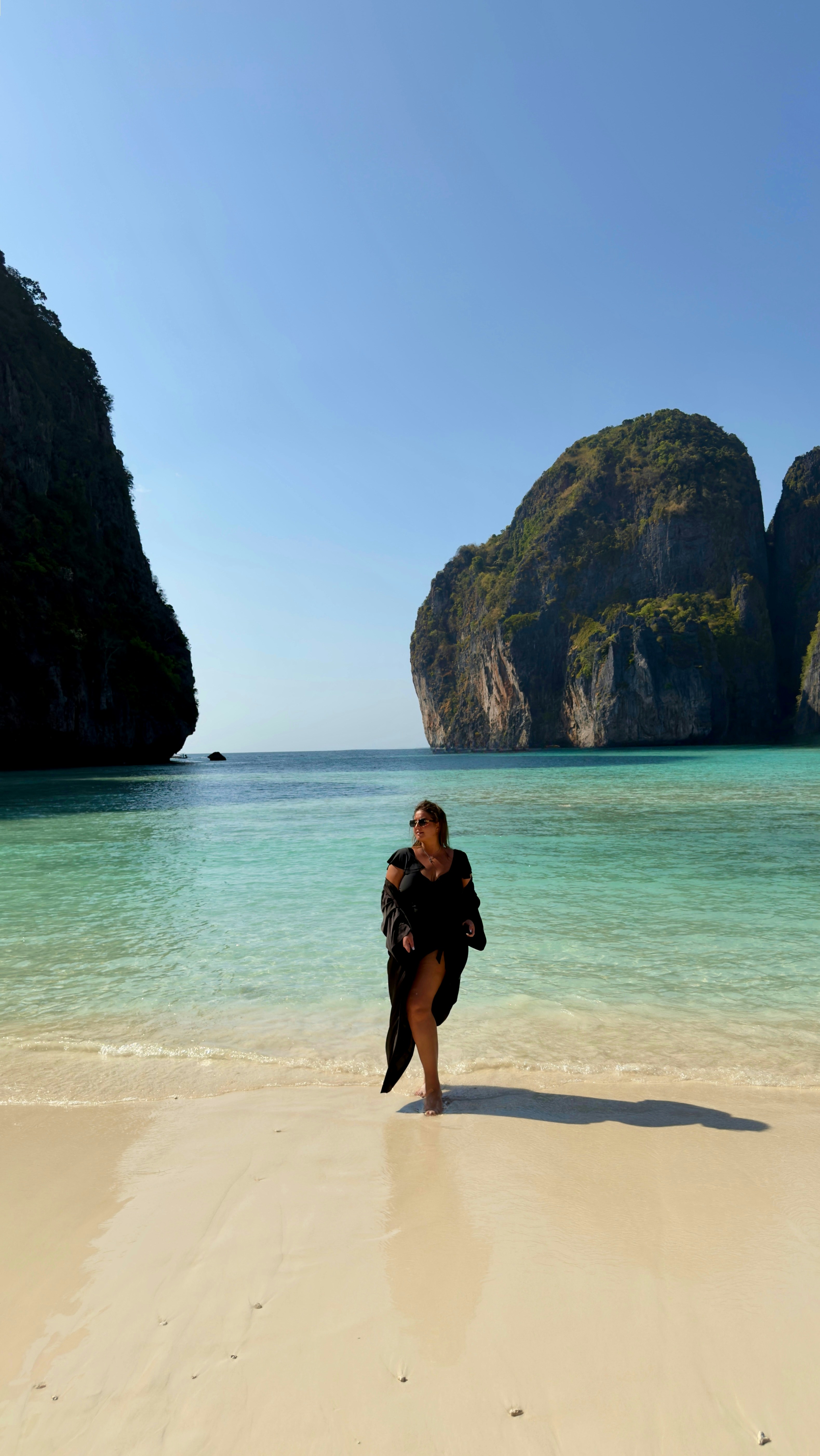 Solitary silhouette at the edge of turquoise sea