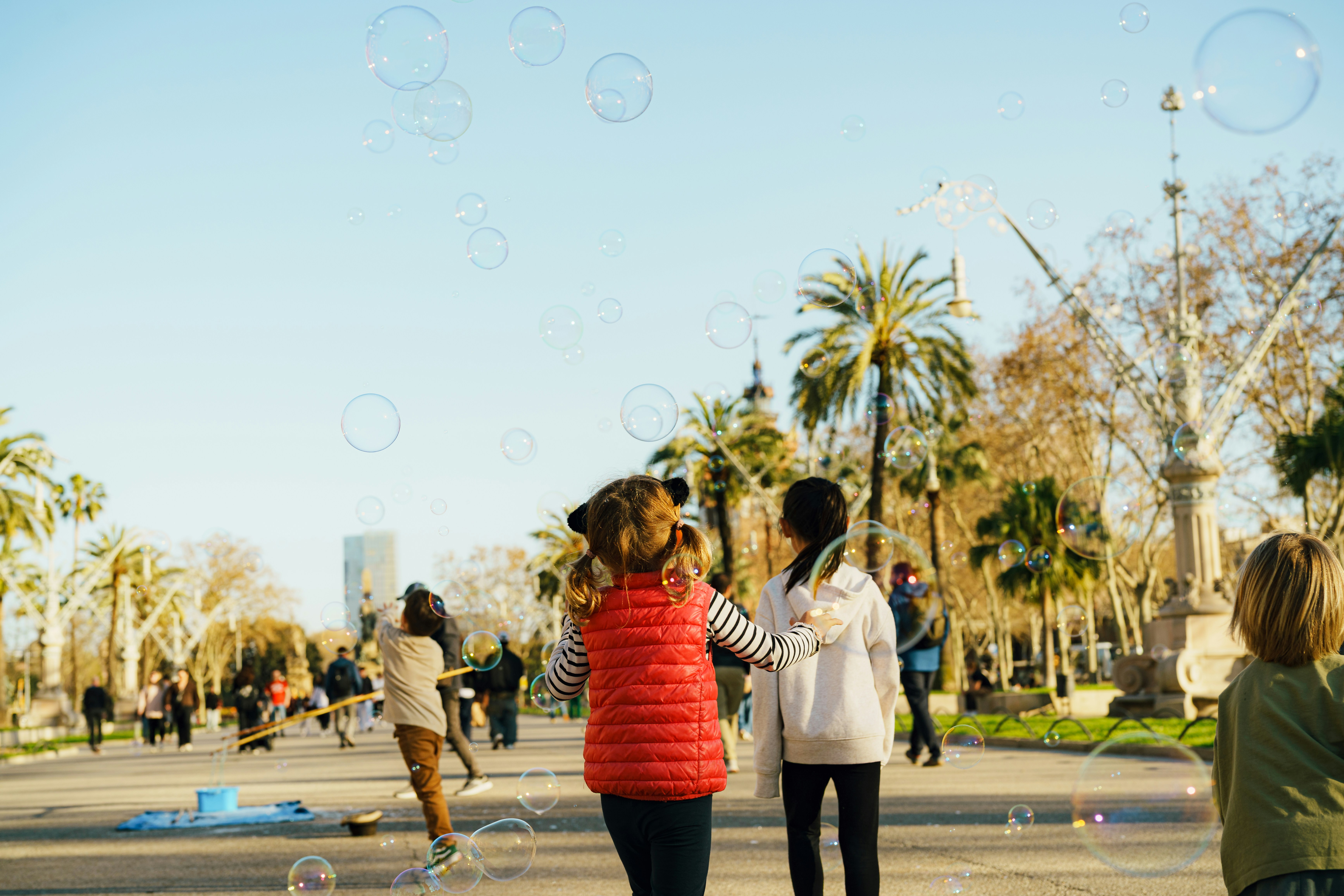 Umbrella of Laughter: A Sunlit Park Portrait