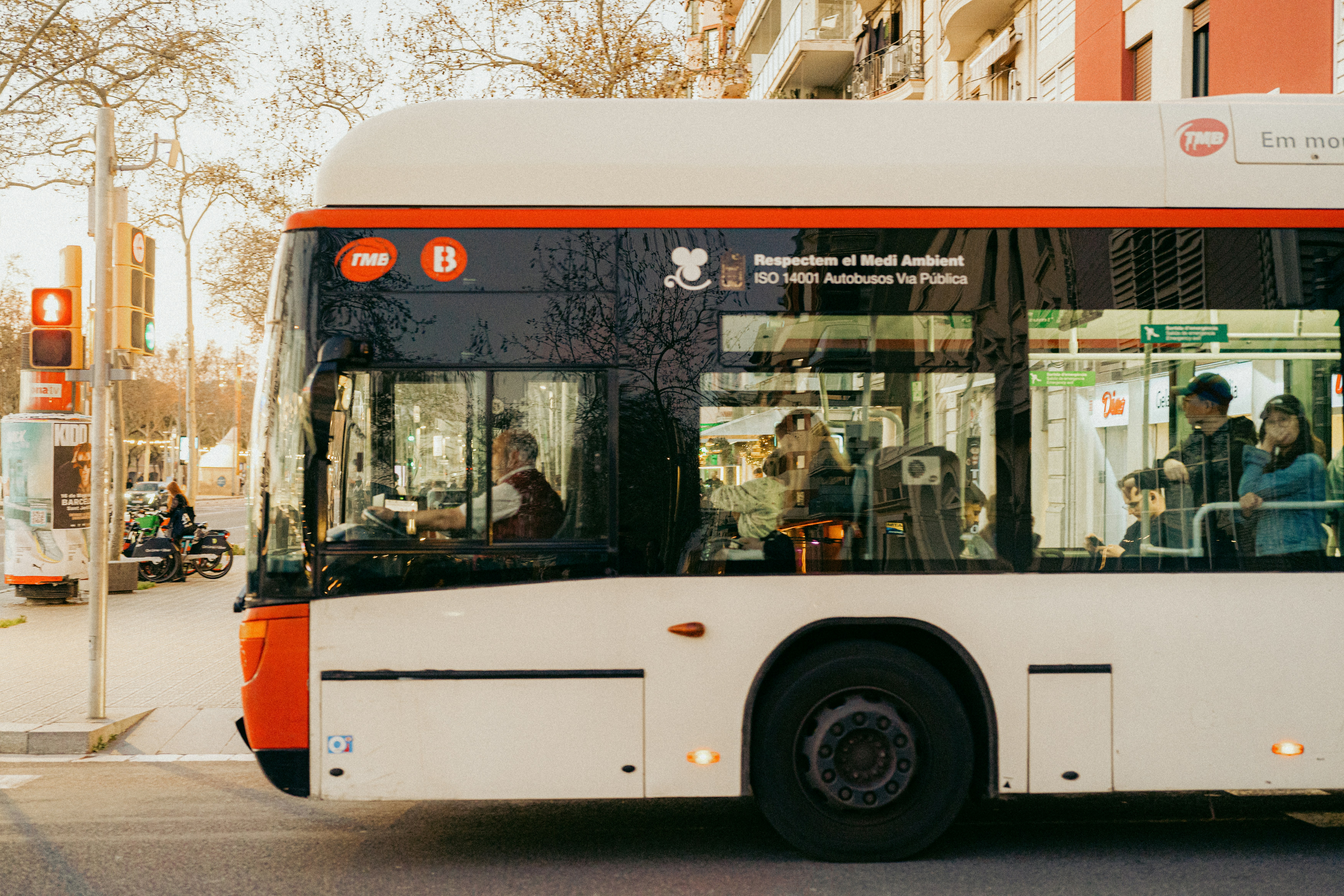 City Bus in Motion: Glass, Light, and Quiet Inside
