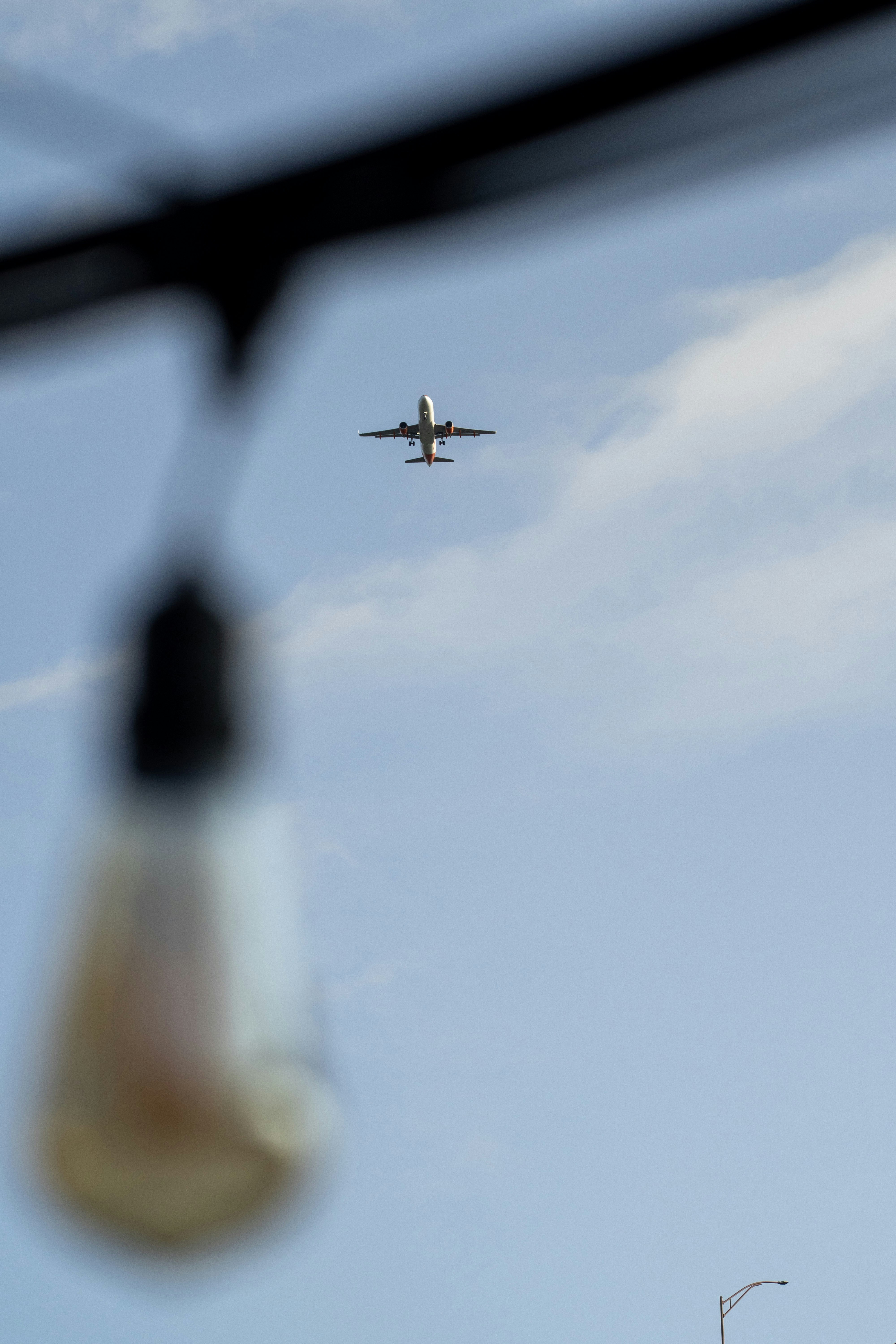 Airliner in sharp focus from a dramatic foreground silhouette