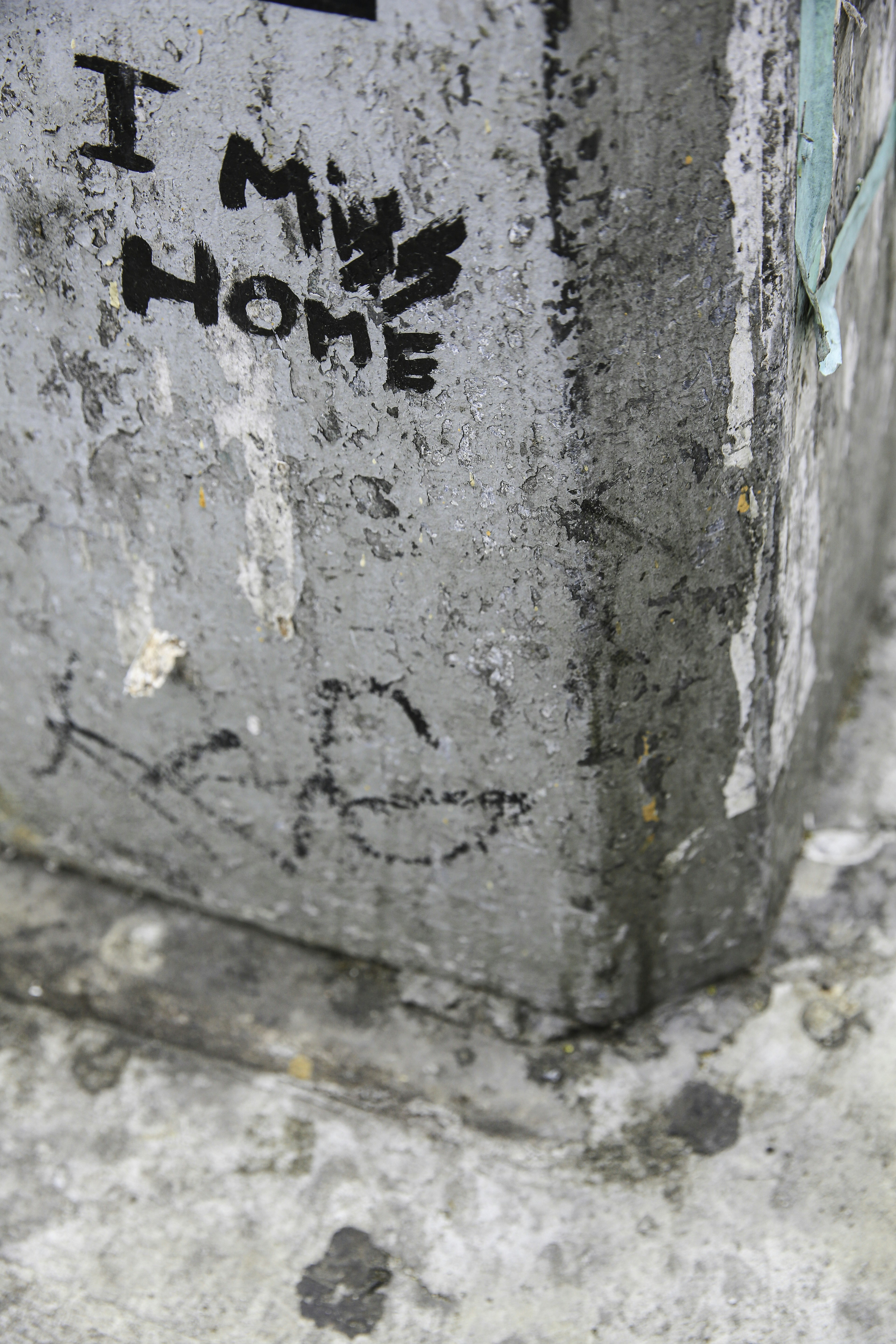 Concrete Corner: Graffiti, Graze of Weathered Signage