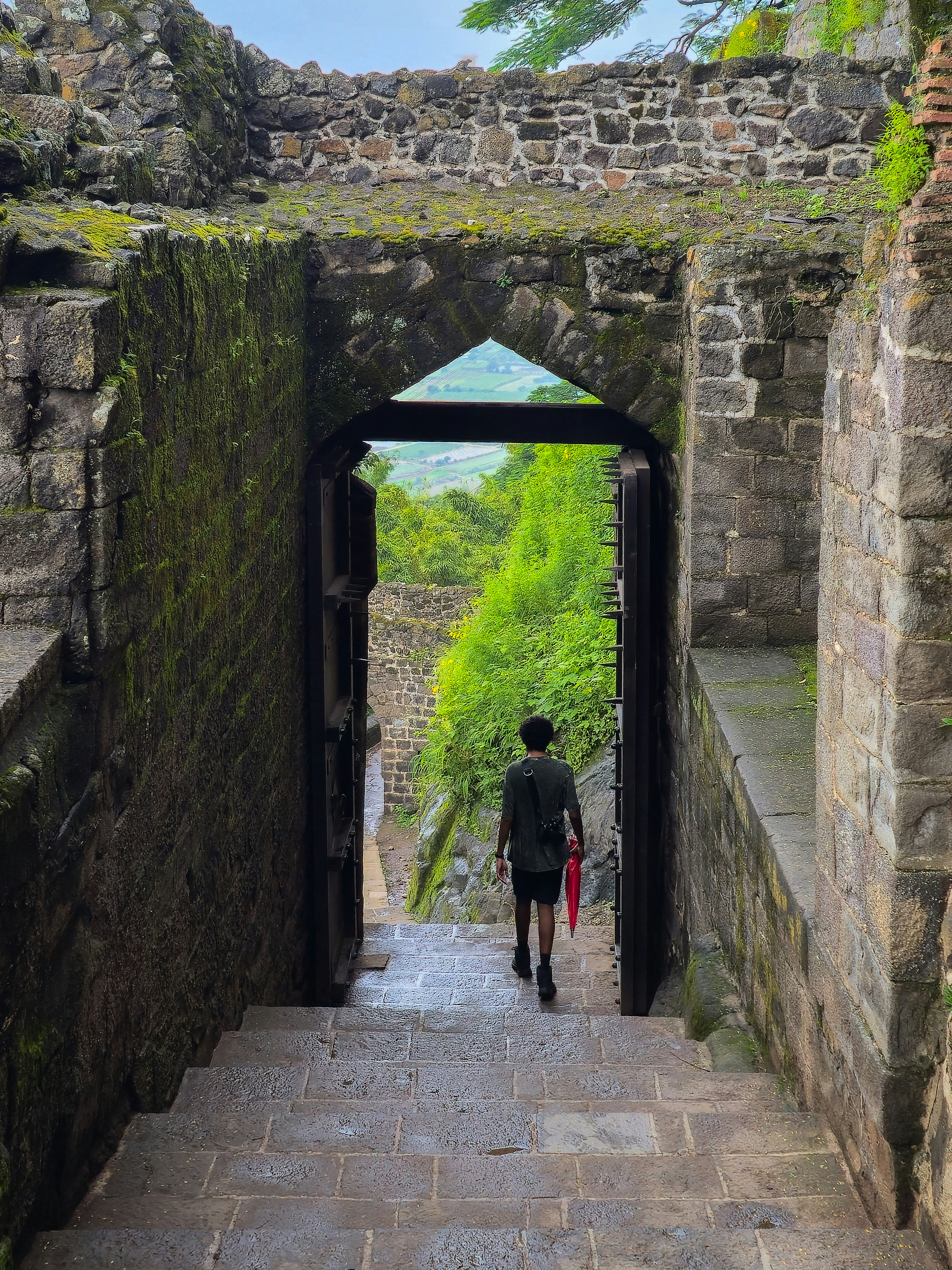 Through the Arch Gate: A Quiet Descent into Green Valleys
