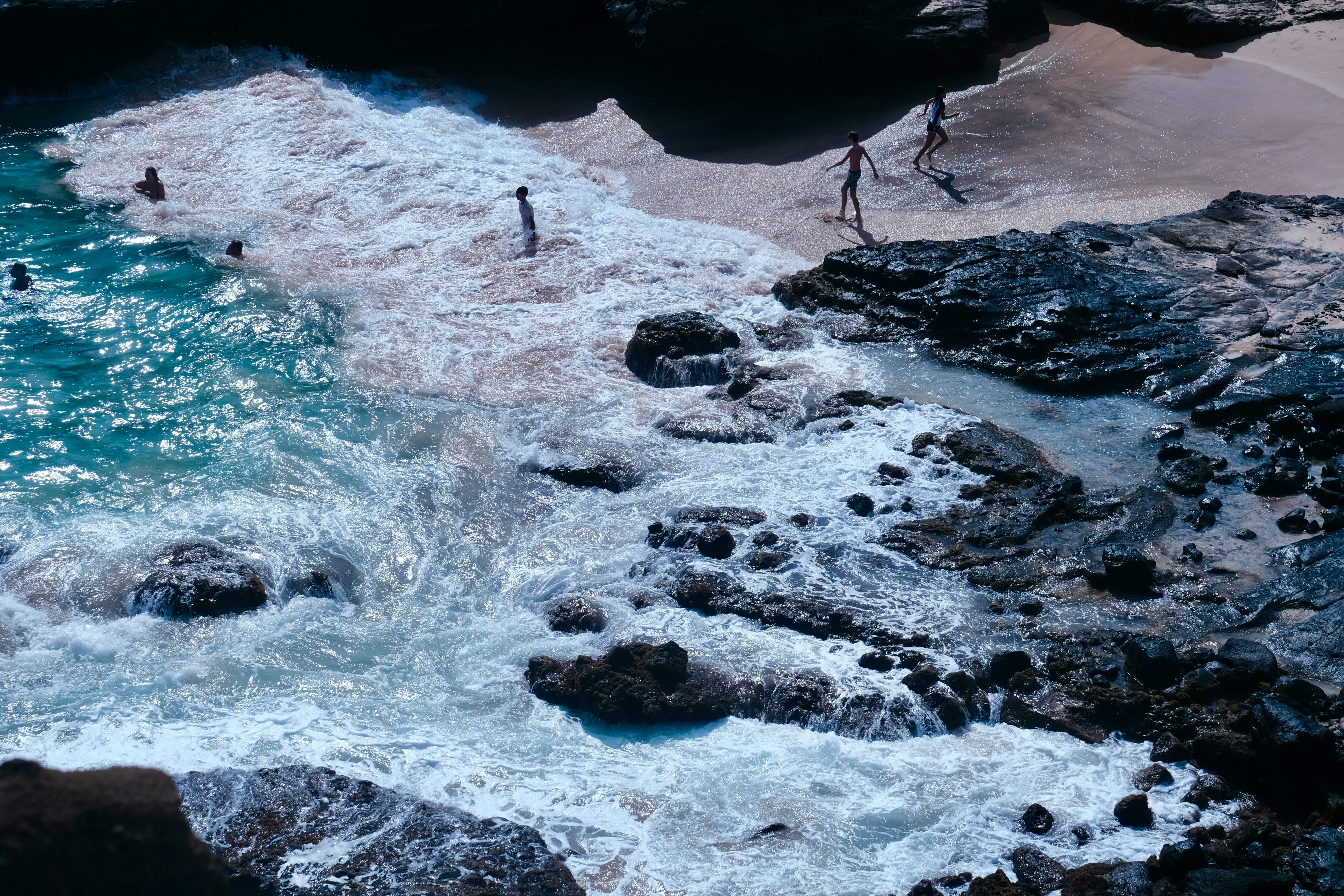 Sea Spray and Granite: People on the Edge of a Turquoise Cove