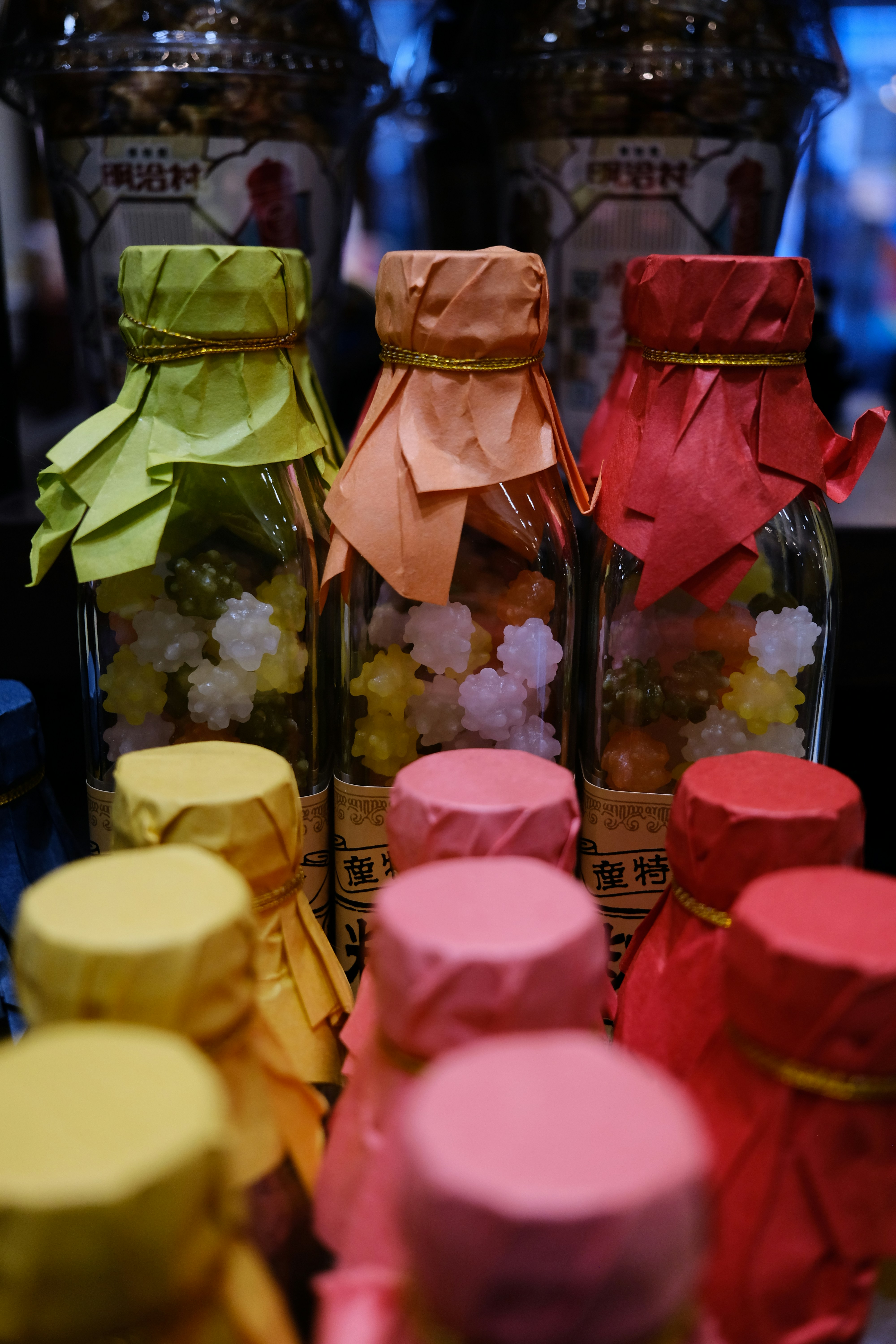 Colorful Bottles in a Dim Market Corridor