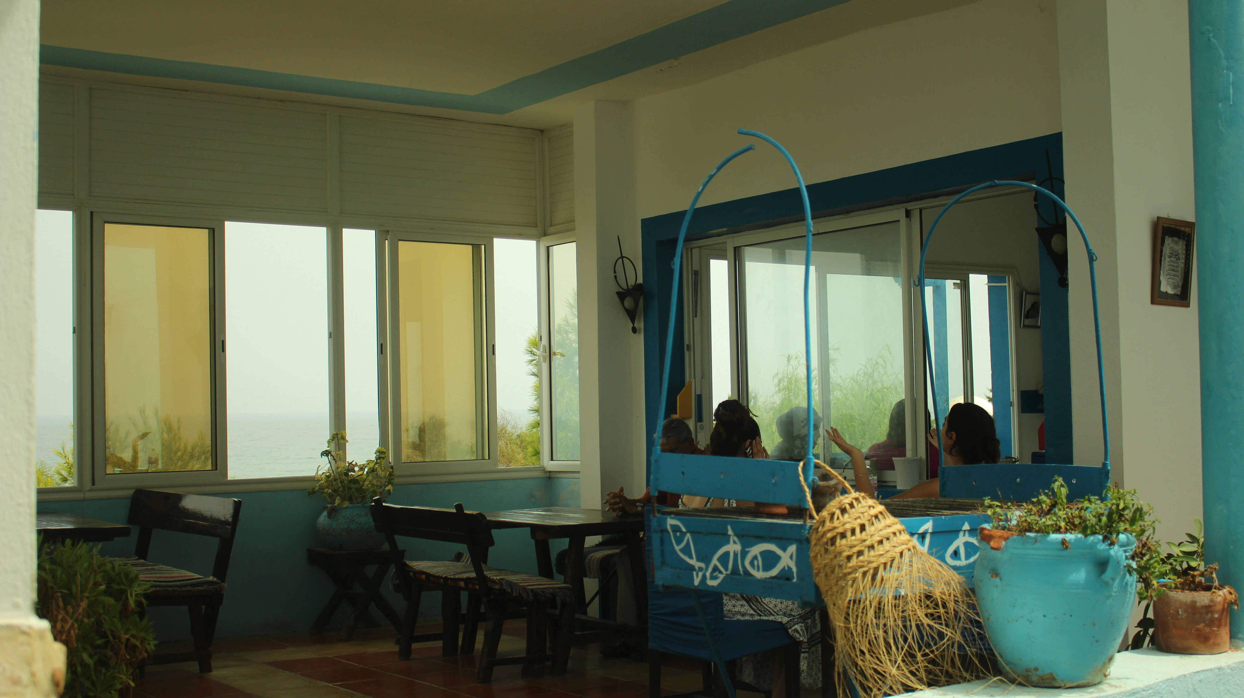 Blue Waterfront Café Portrait in Soft Evening Light