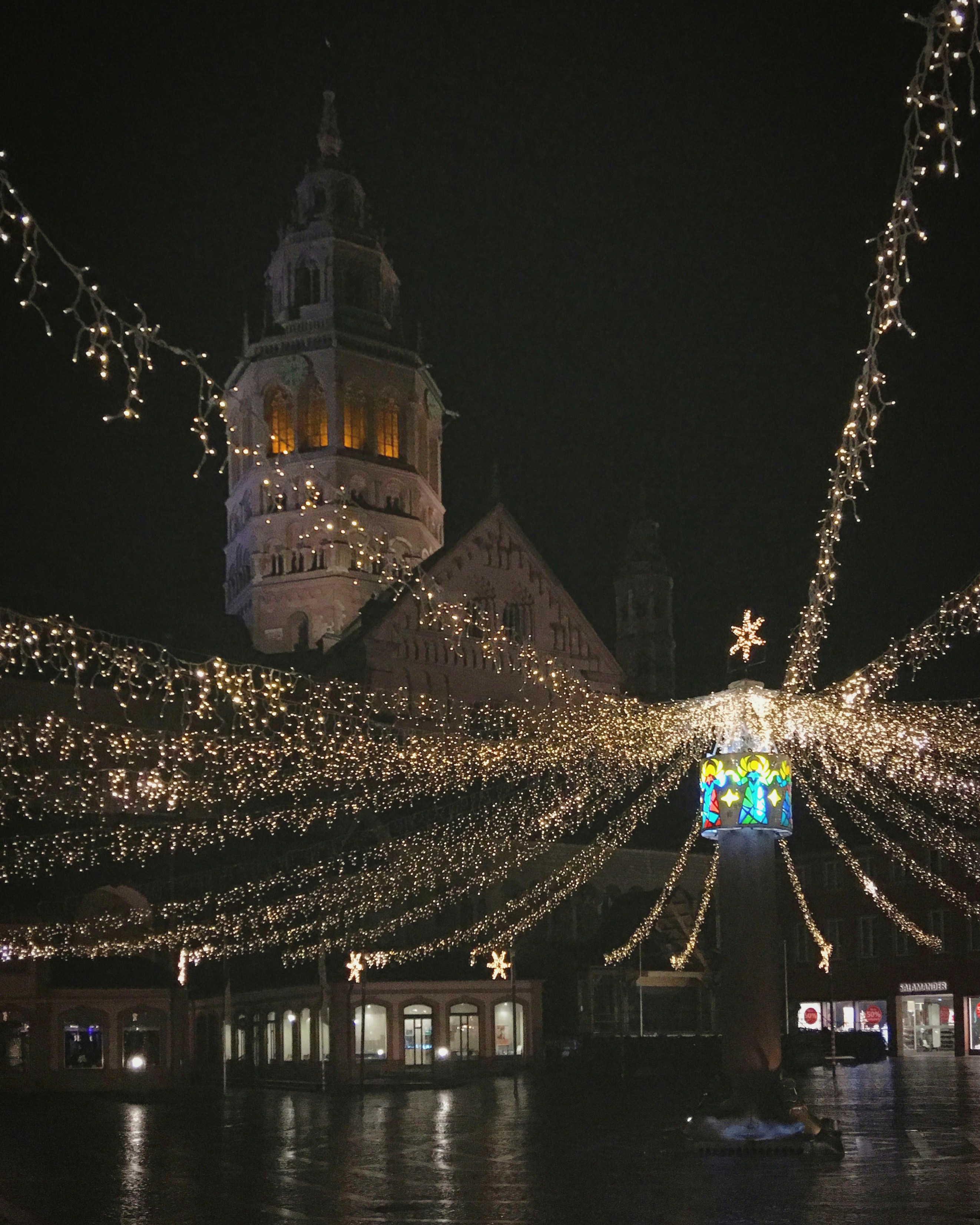 Cascade of Christmas Lights Above the Silent Plaza
