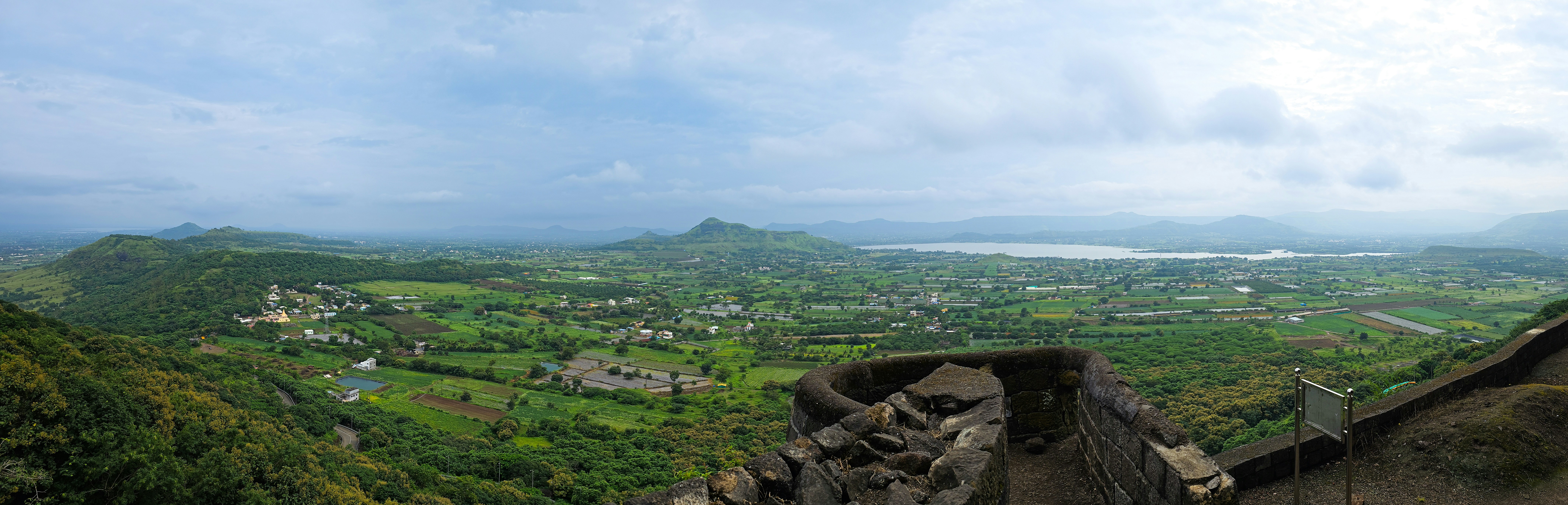 Panorama from the Ramparts: Green Valleys Stretch to Distant Hills