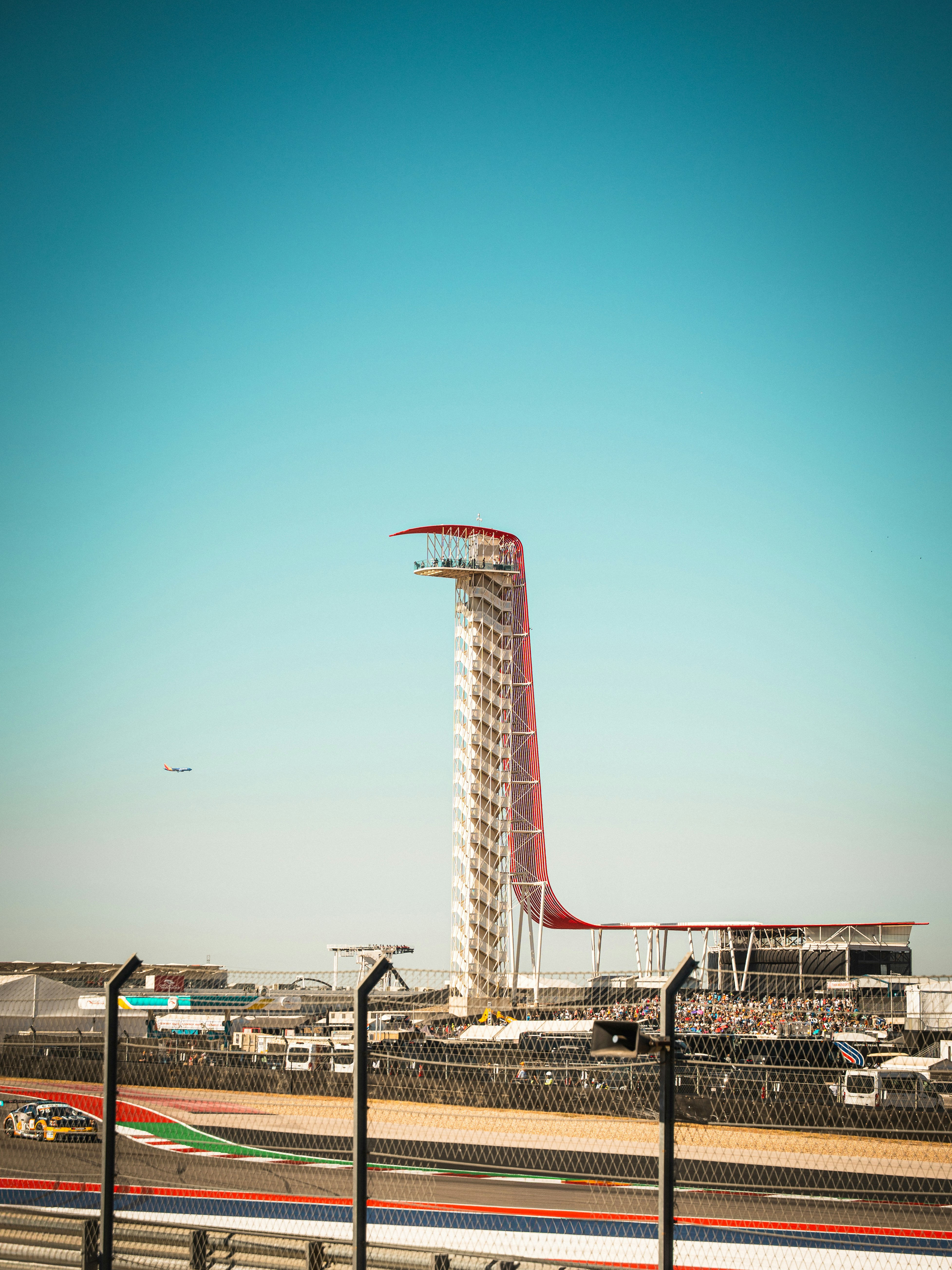 Towering Curve: The Grandstand’s Silhouette Against a Clear Sky