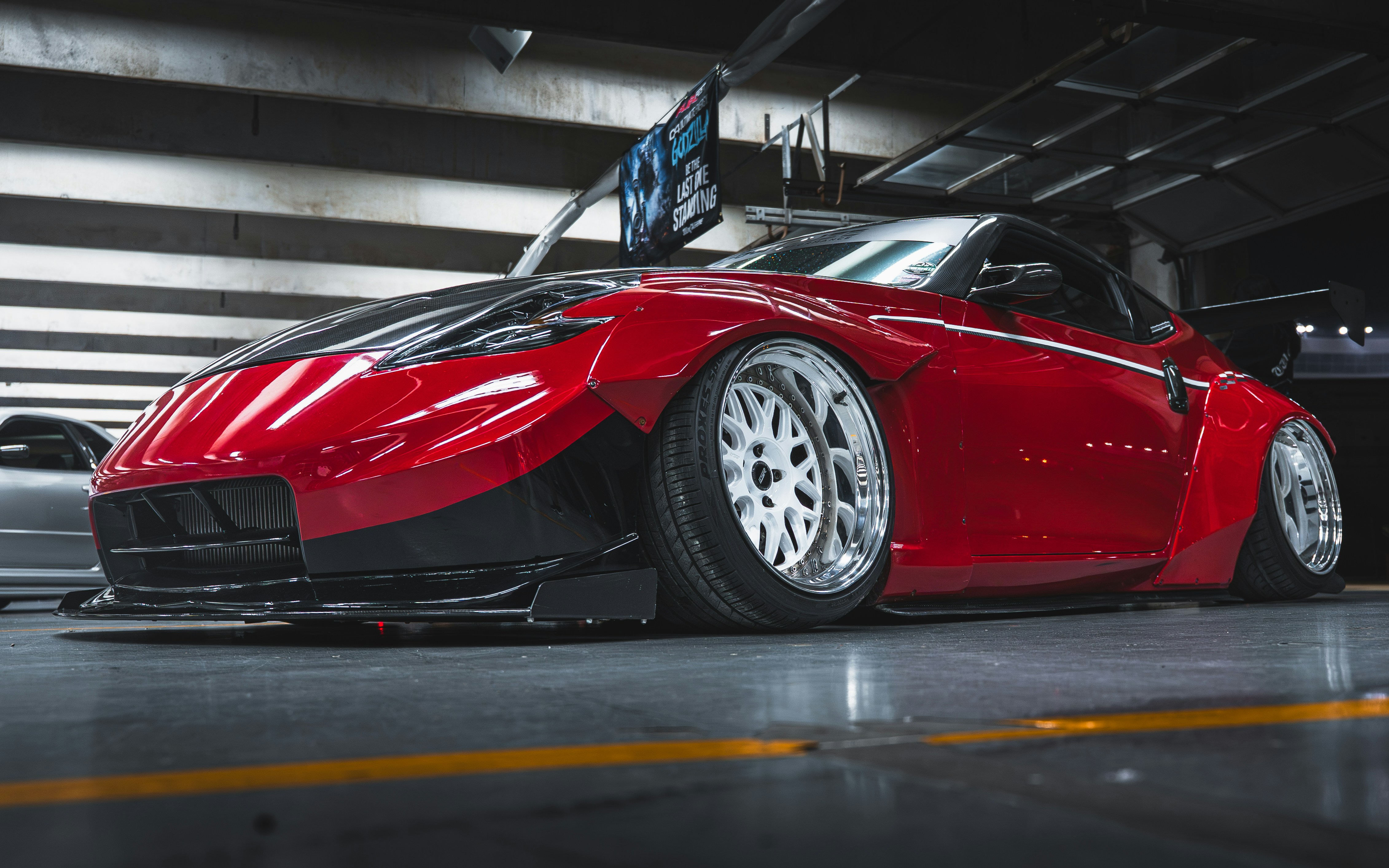 Low-angle Red: A Showcar Resting in an Underground Studio
