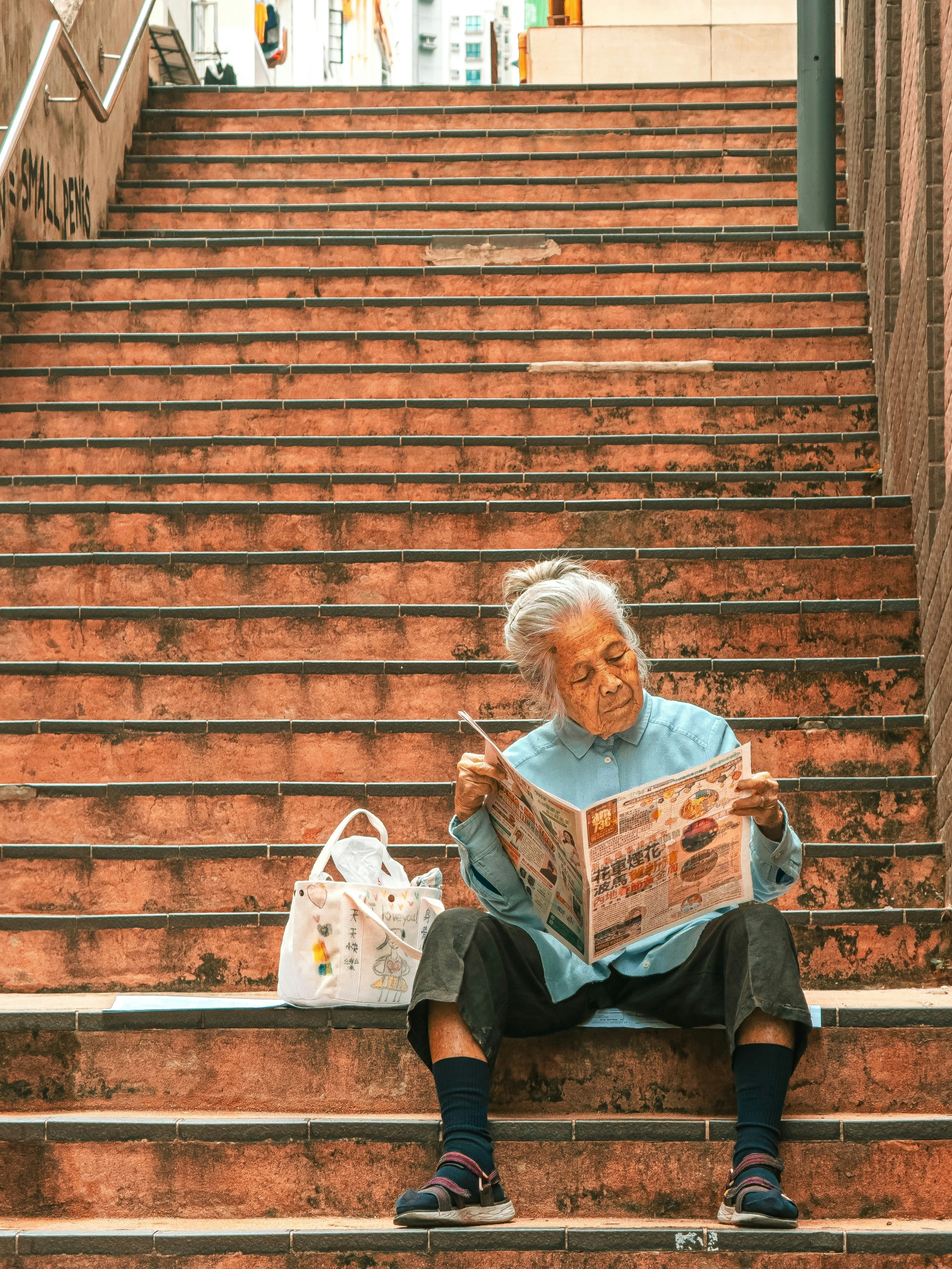 Old Reader on Concrete Steps