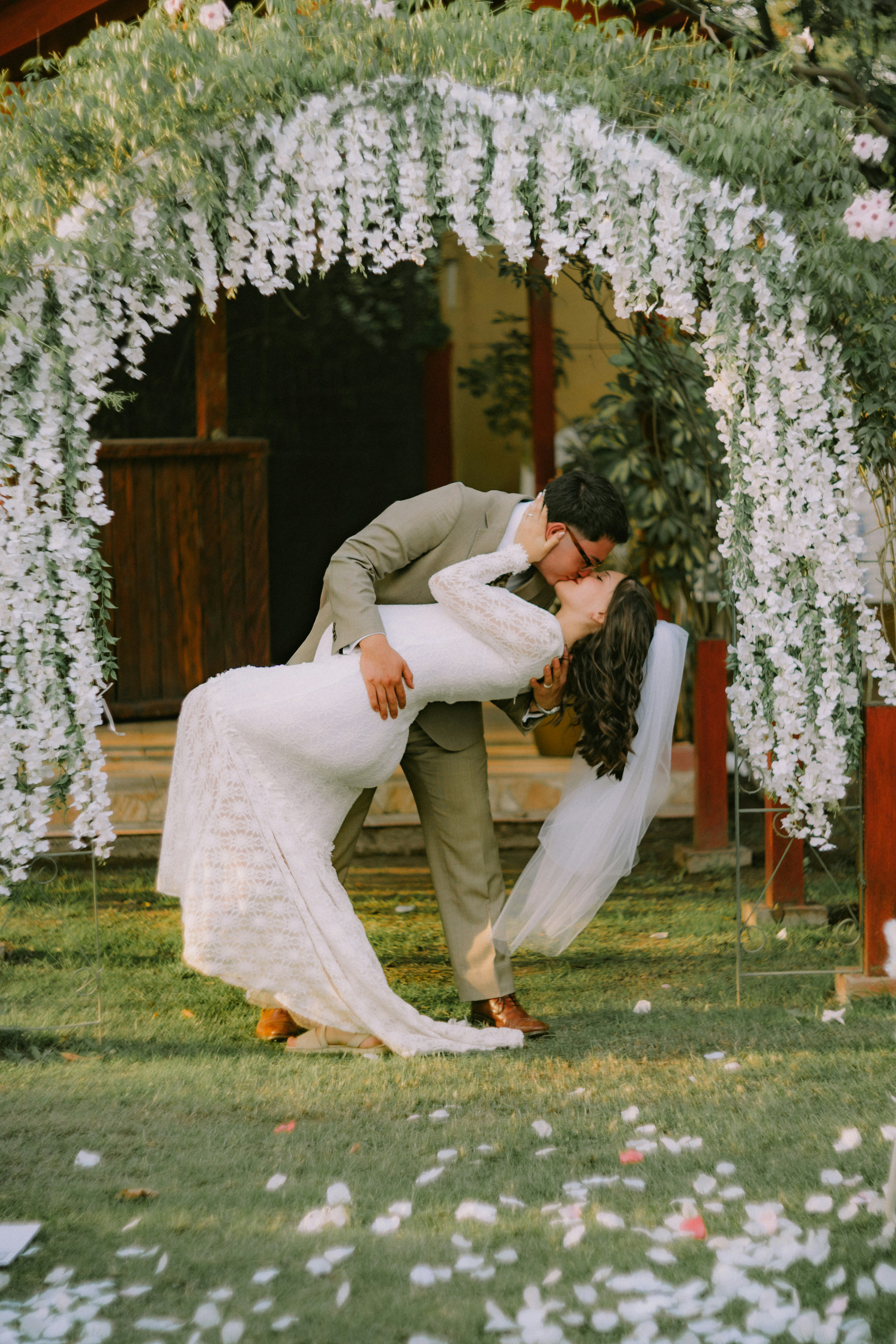 A Timeless Dip: The Wedding Waltz Under a Floral Arch