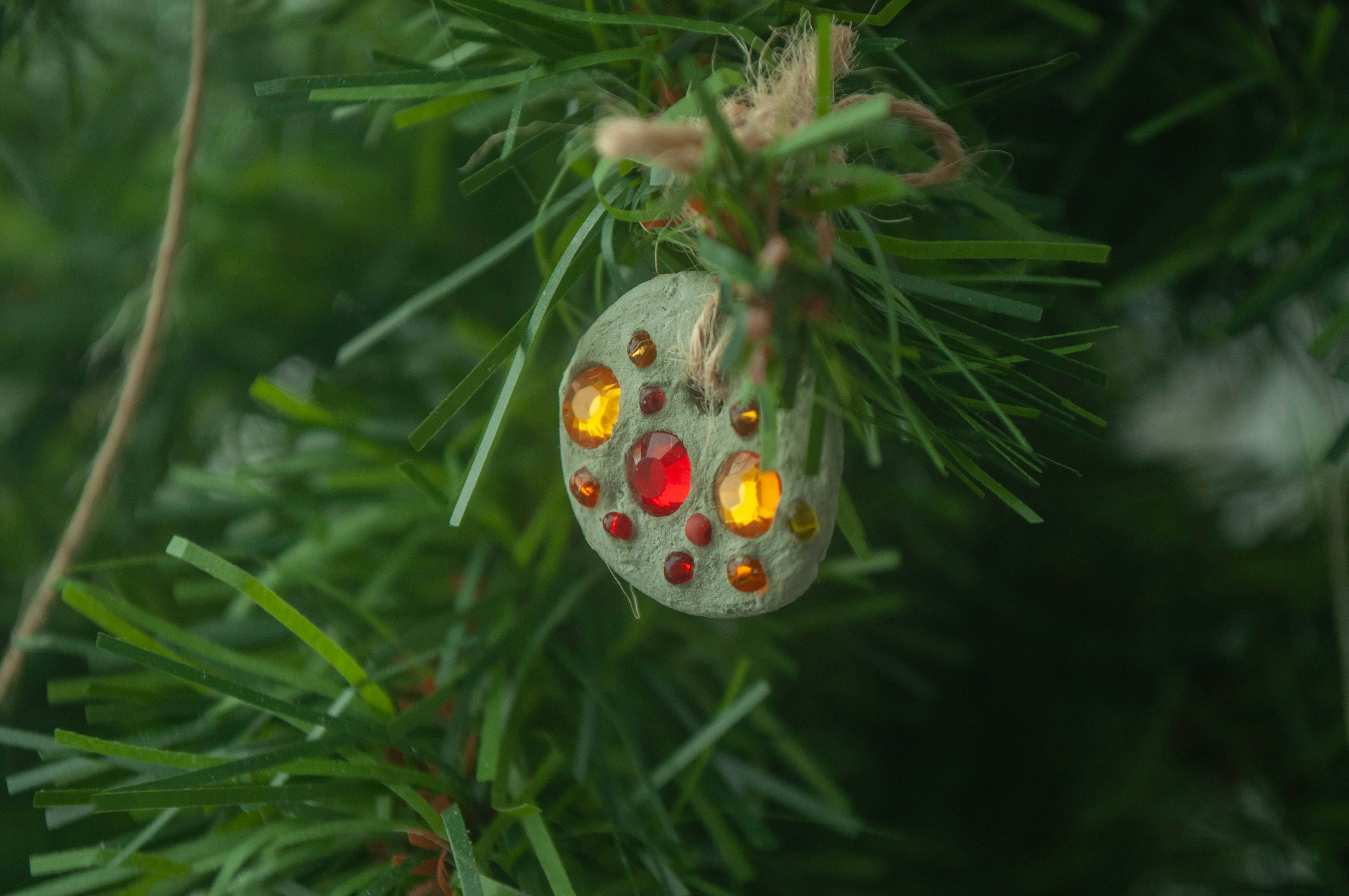 Gemstone Ornament Adorned on a Pine Needle