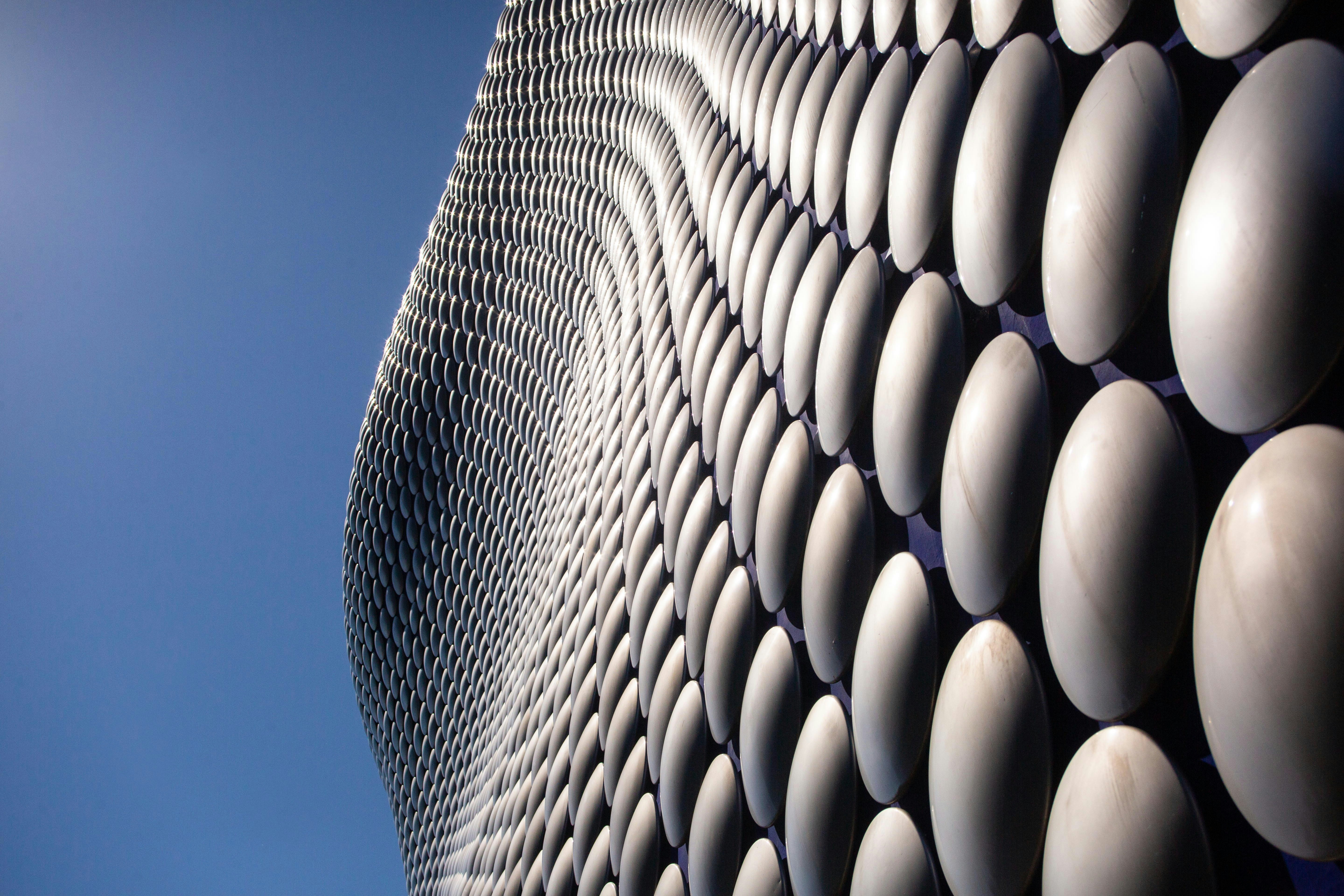 Rhyme of Ridges: A Faceted Facade Receding into the Sky