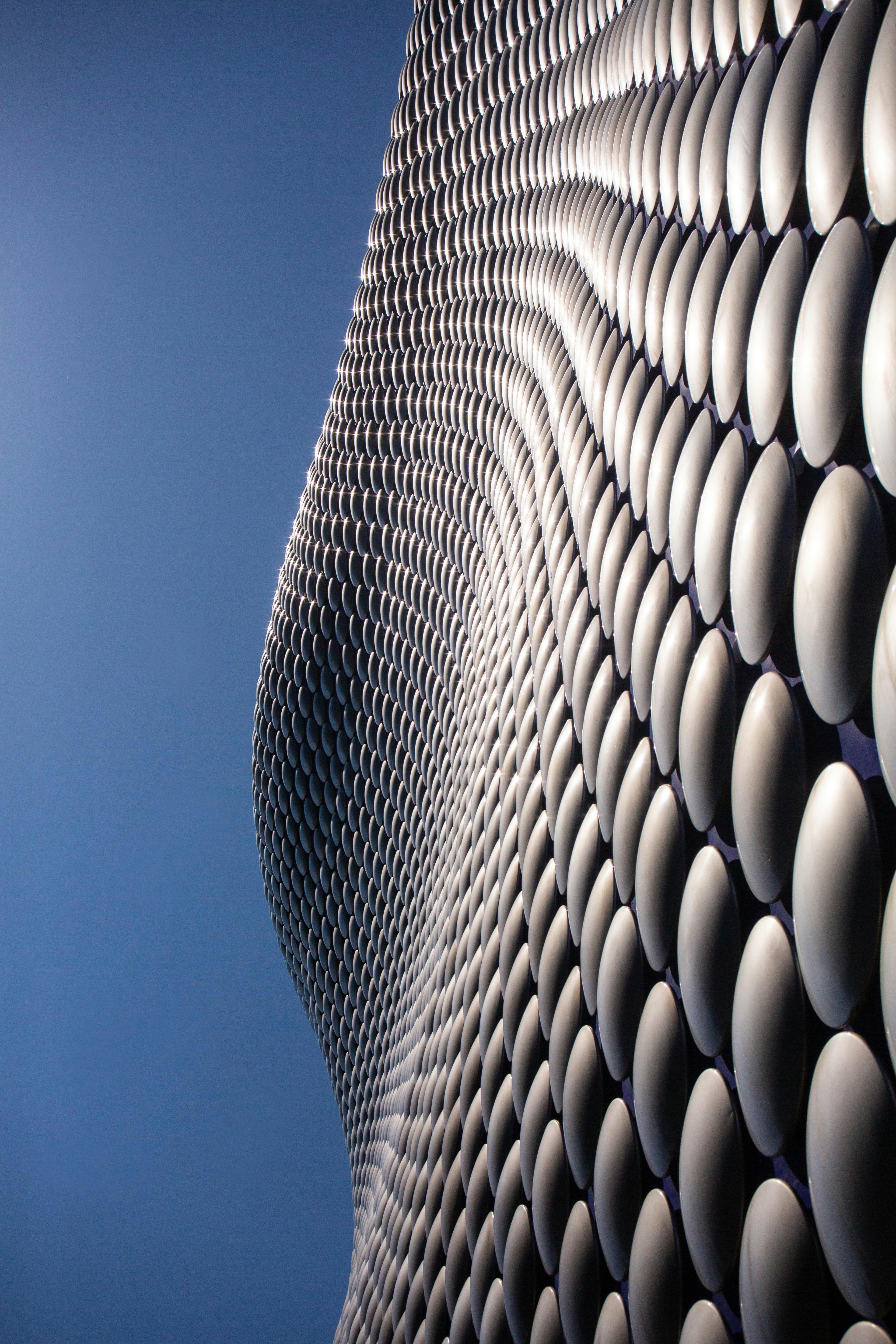 The Curved Facade: Repeating Ellipses in Light and Shadow