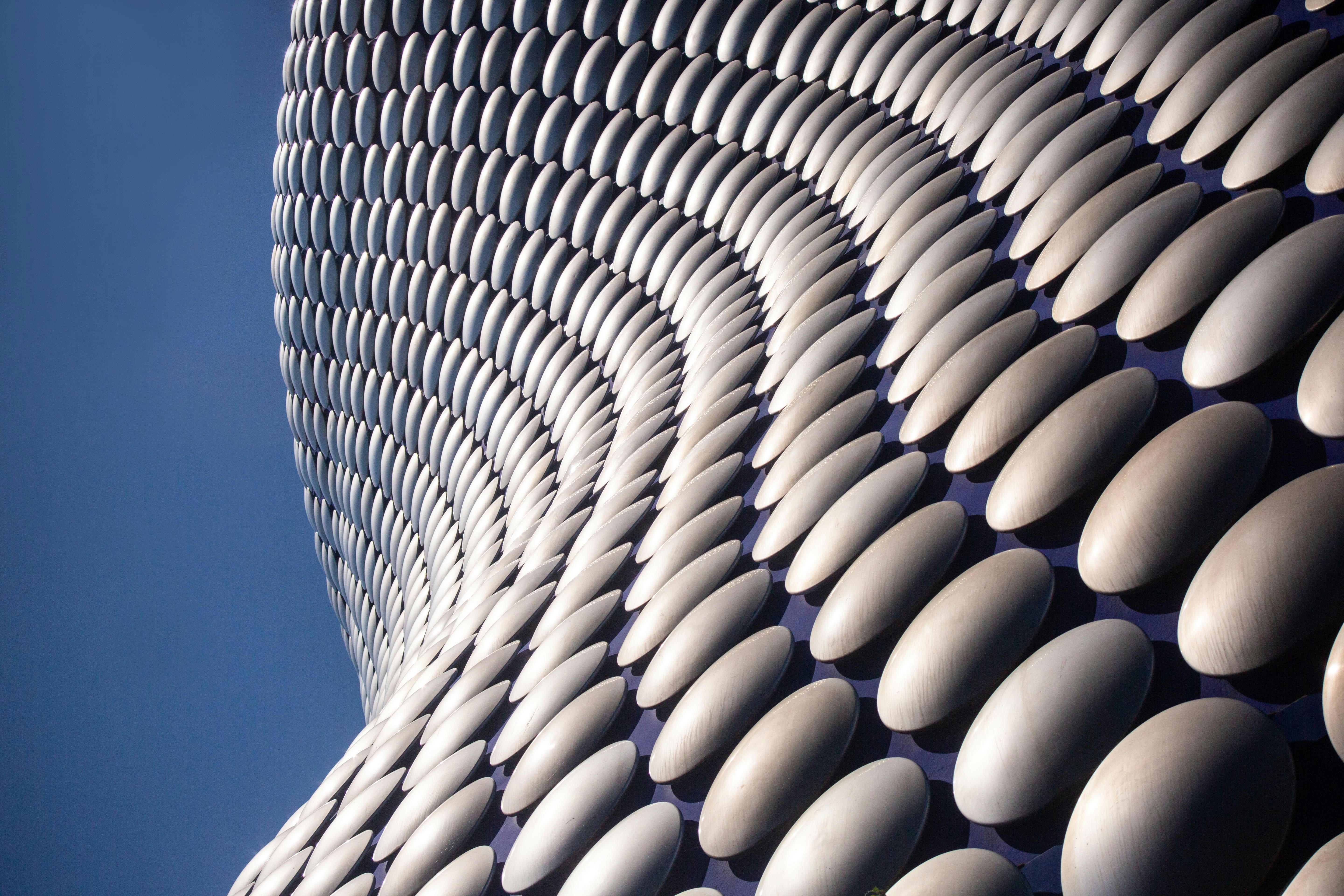 Curved Facade: Repeating Ellipses in Blue Depth