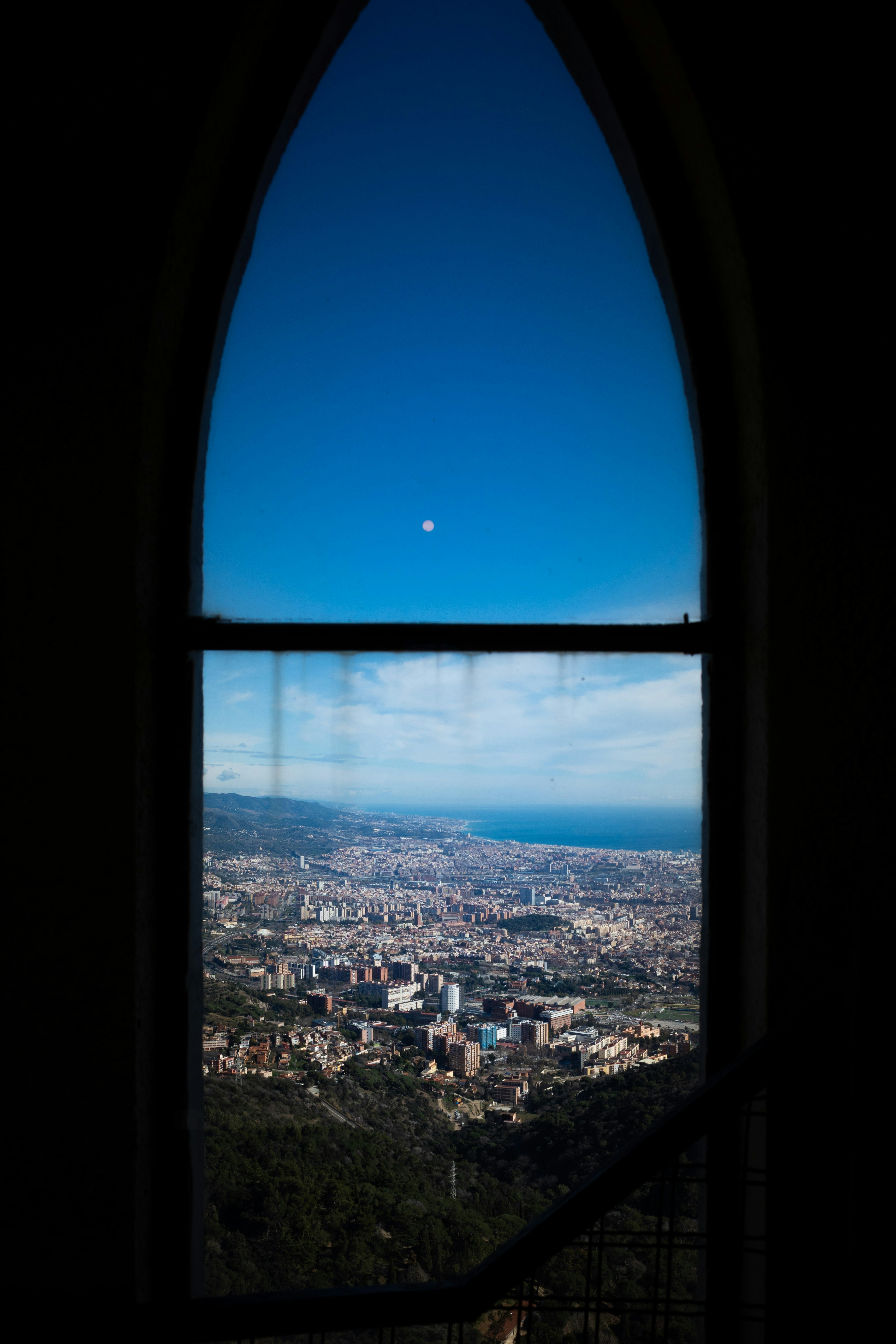 Moonlit Window Overlooking a Mediterranean City