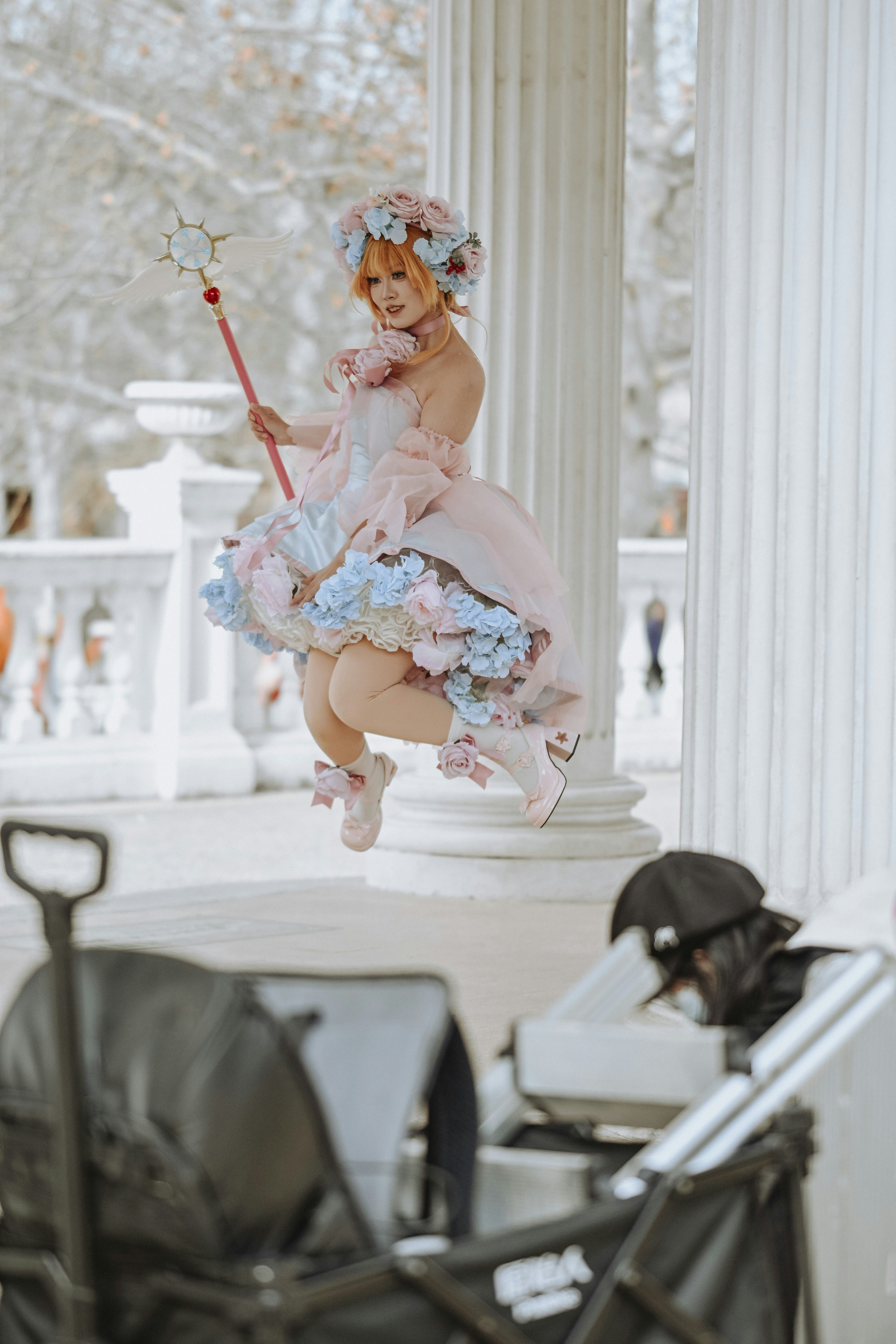 Graceful leap: a pastel princess suspended between columns