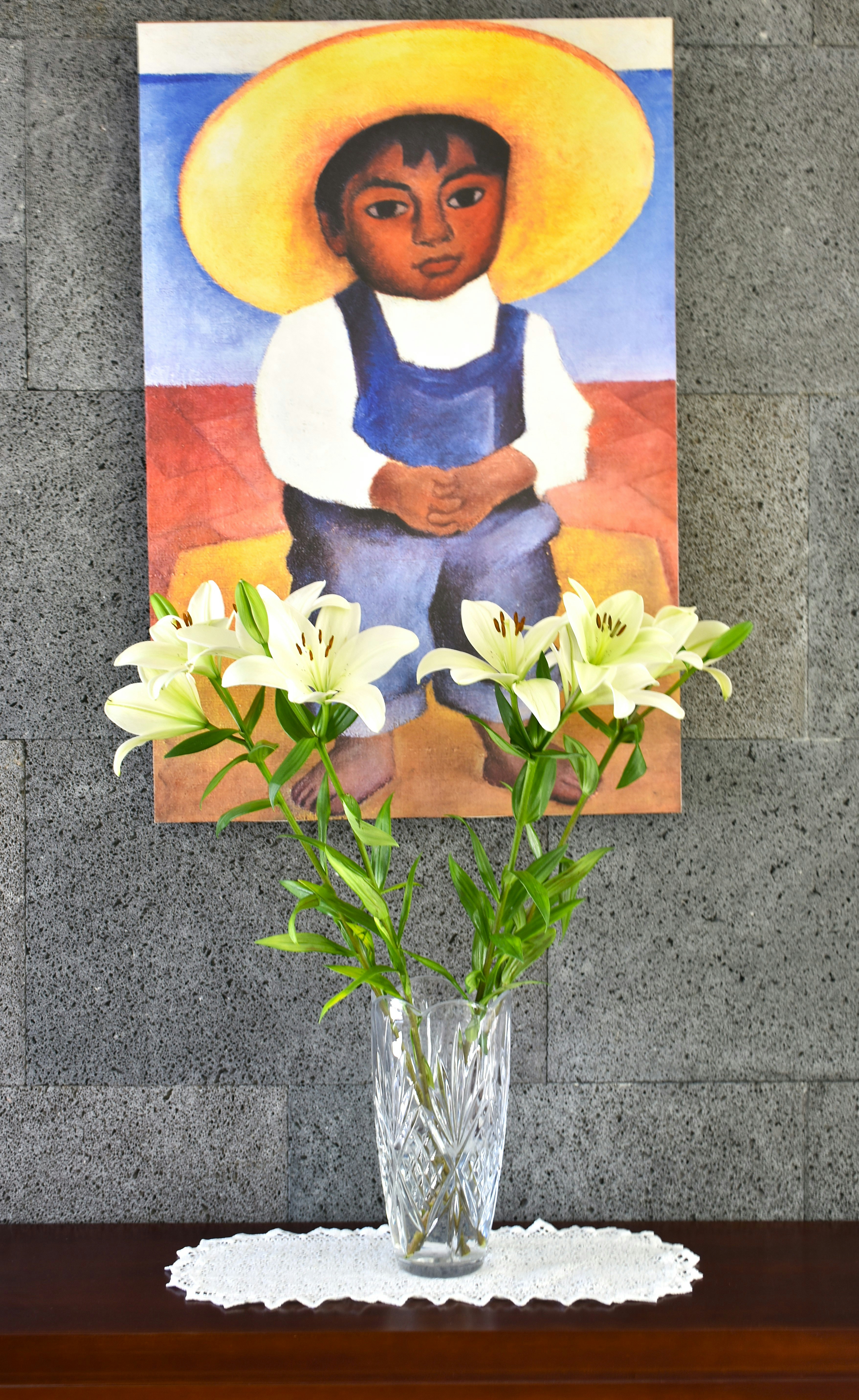 Portrait in Color: A Child in a Wide Brimmed Hat Stands Above Lily Vases