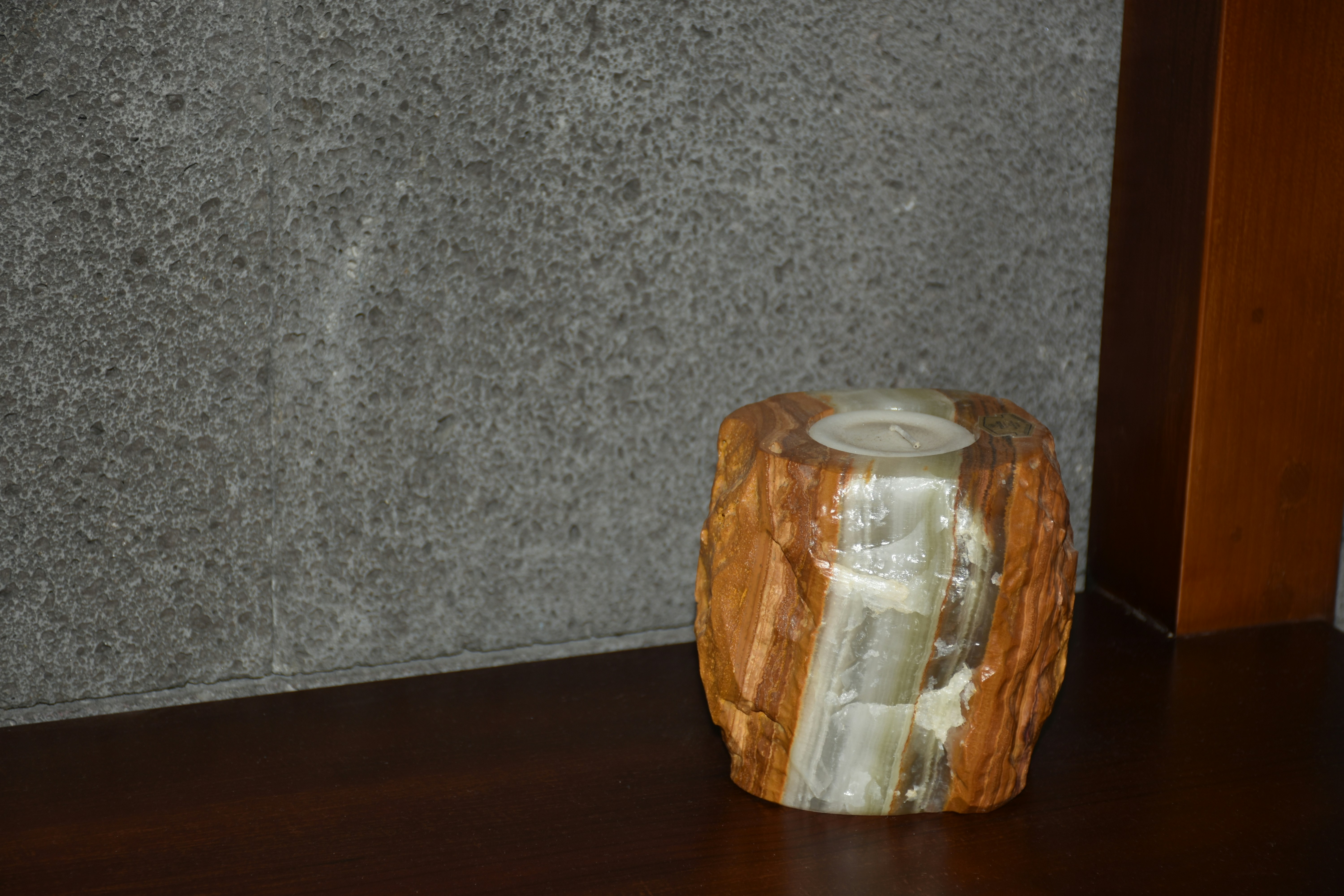 Candled Core: A Soothing Glow Amid Dark Wood and Stone