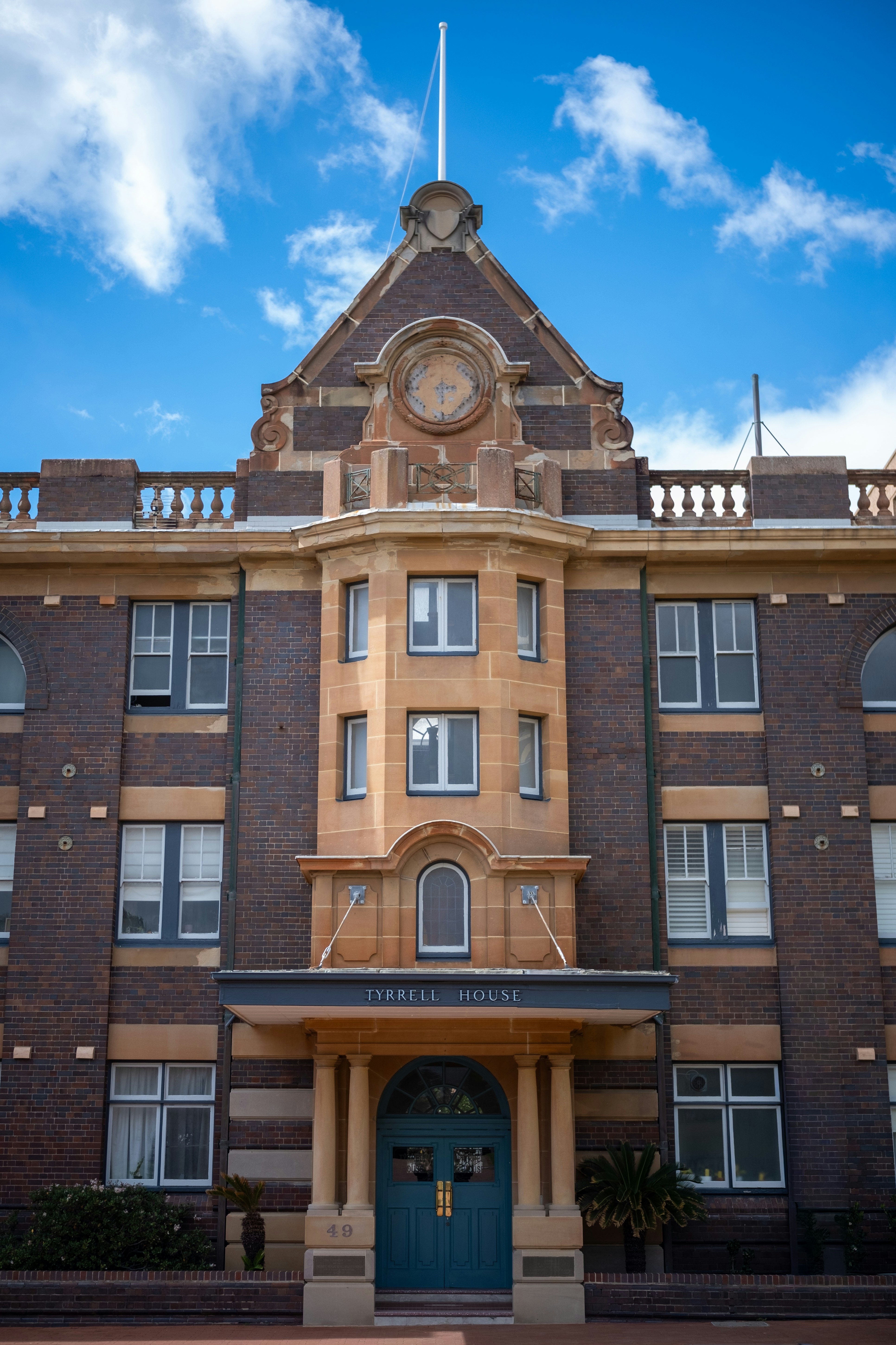 Tyrell Hall: A brick-built Facade with Central Bay and Blue Portal