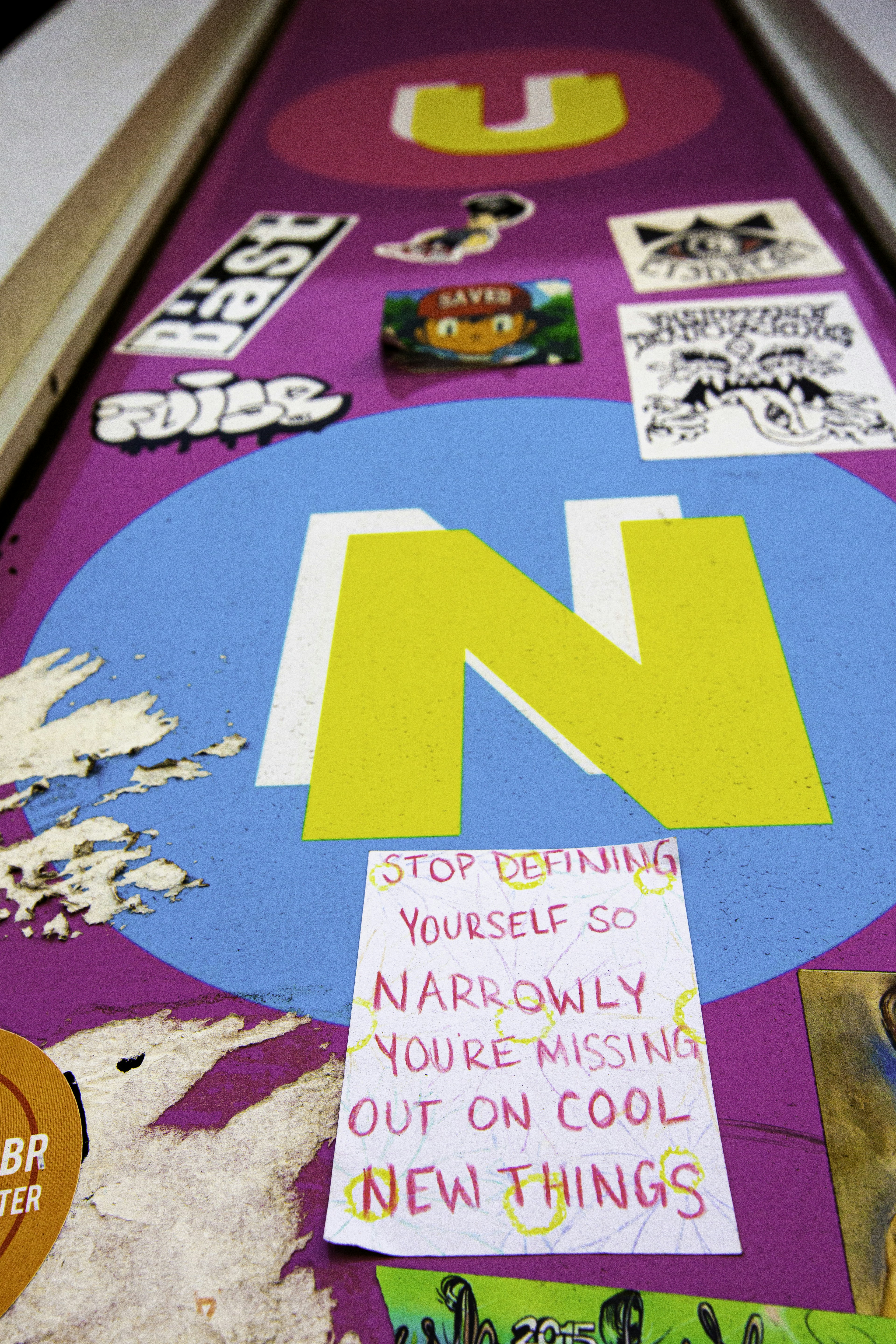 Neon N Plaque: Stickered Playground of Color and Message