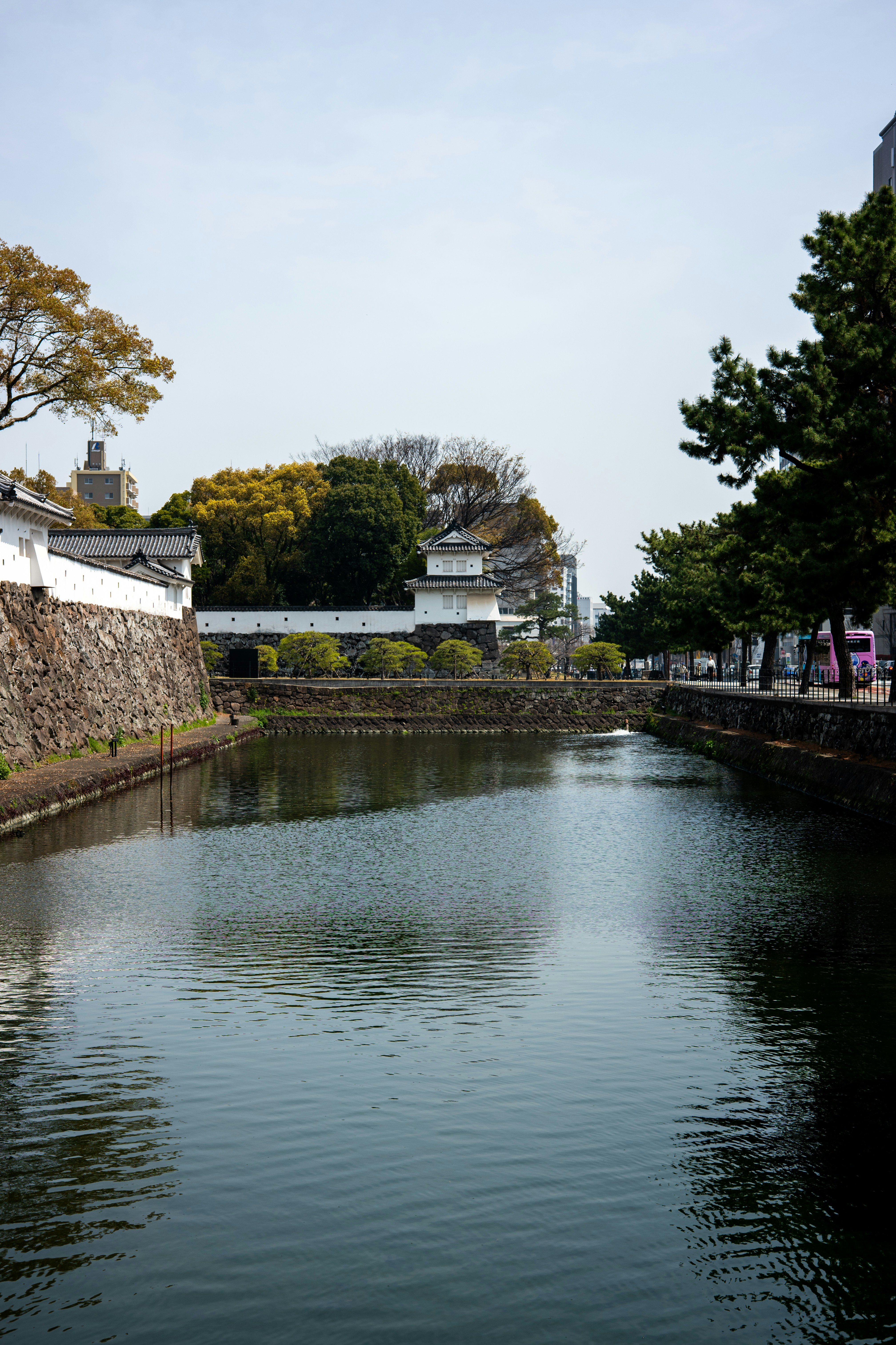 Castle Walls and Reflection: A Tranquil Waterway by the City