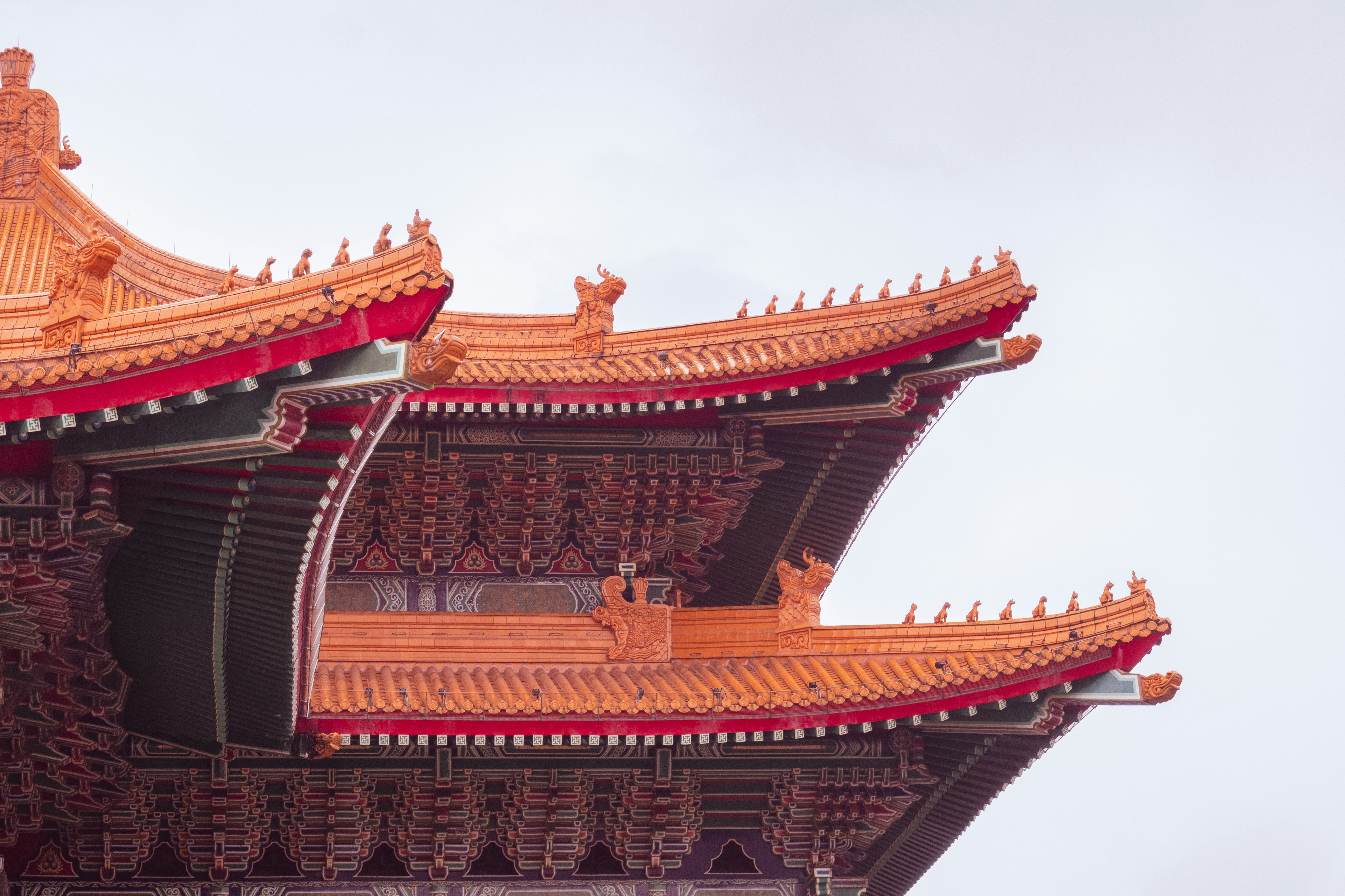 Orange Timbered Peaks: A Close Look at a Traditional Chinese Roofline