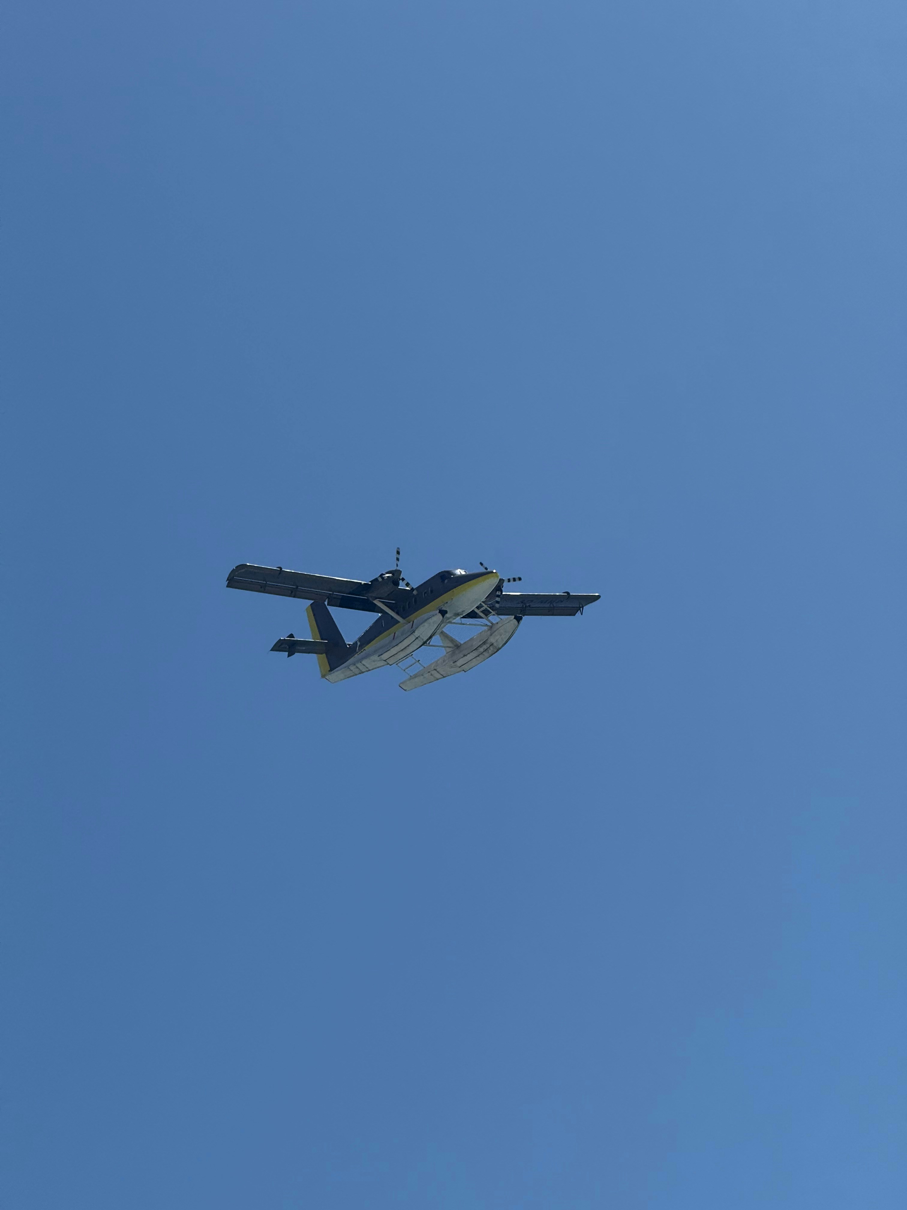 High-Altitude Freighter Skimming a Clear Blue