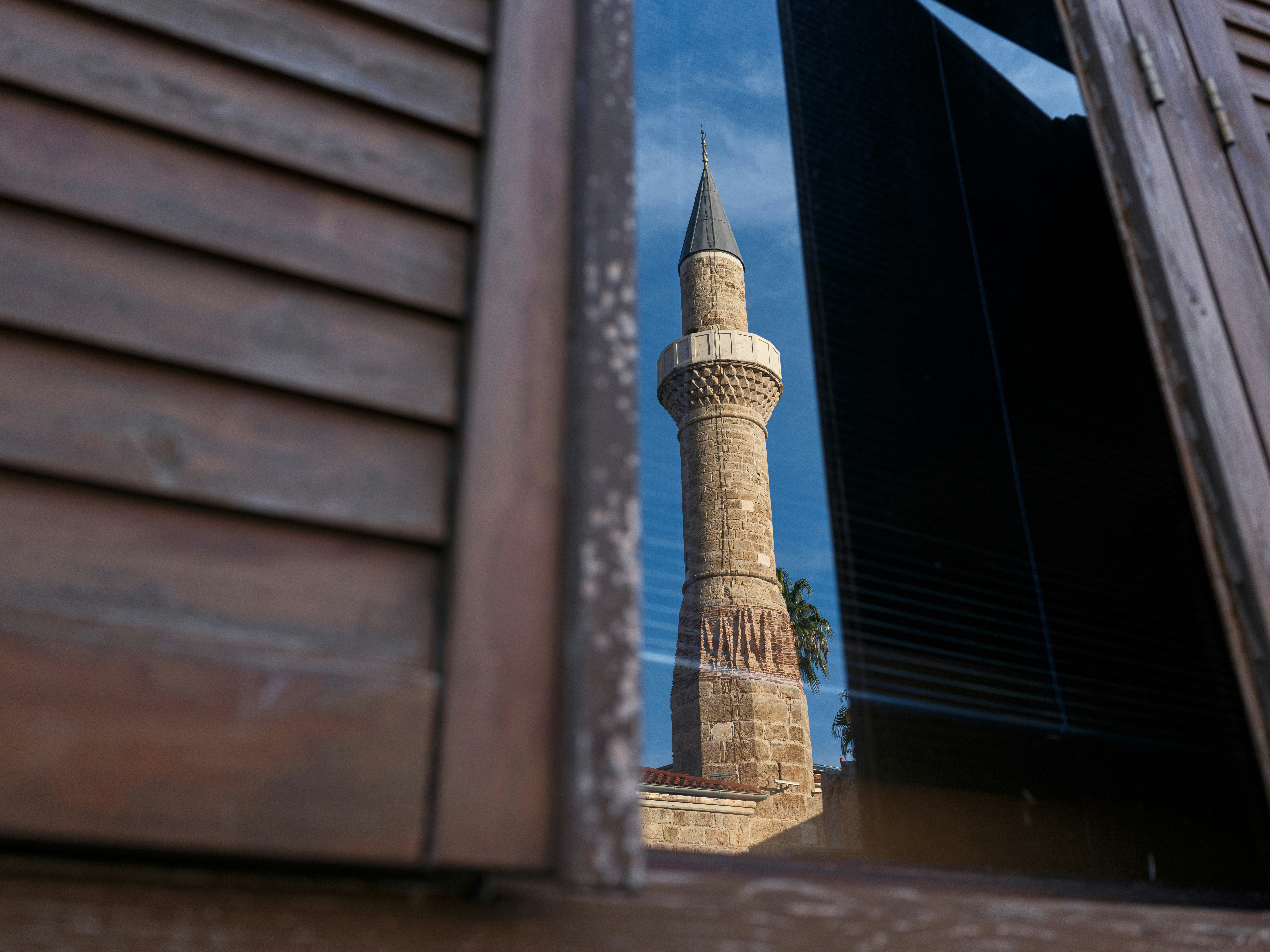 Minaret in a Slate Frame: Reflection of Architecture in a Window