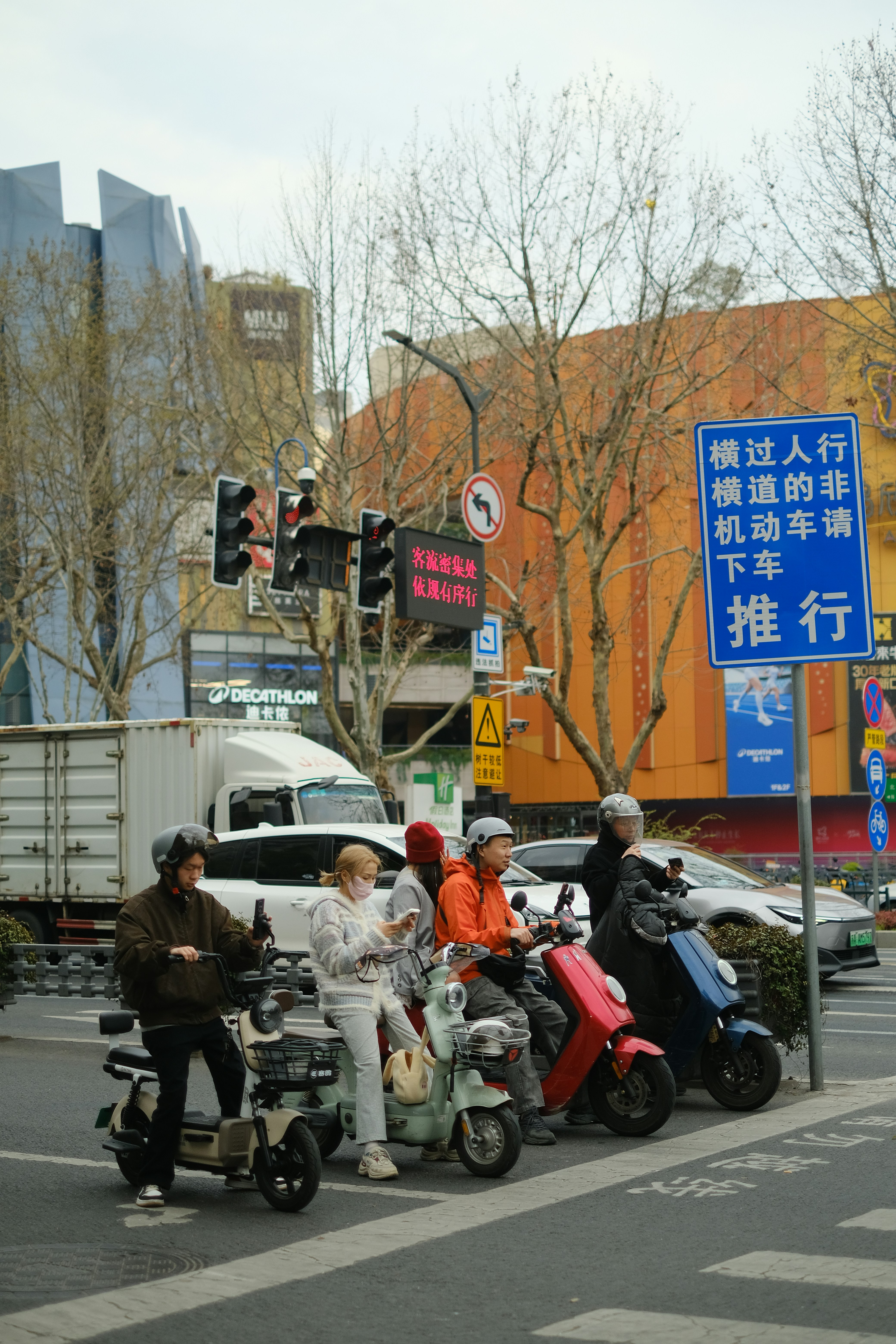 City Crosswalk: Motorbikes Await the Green Signal