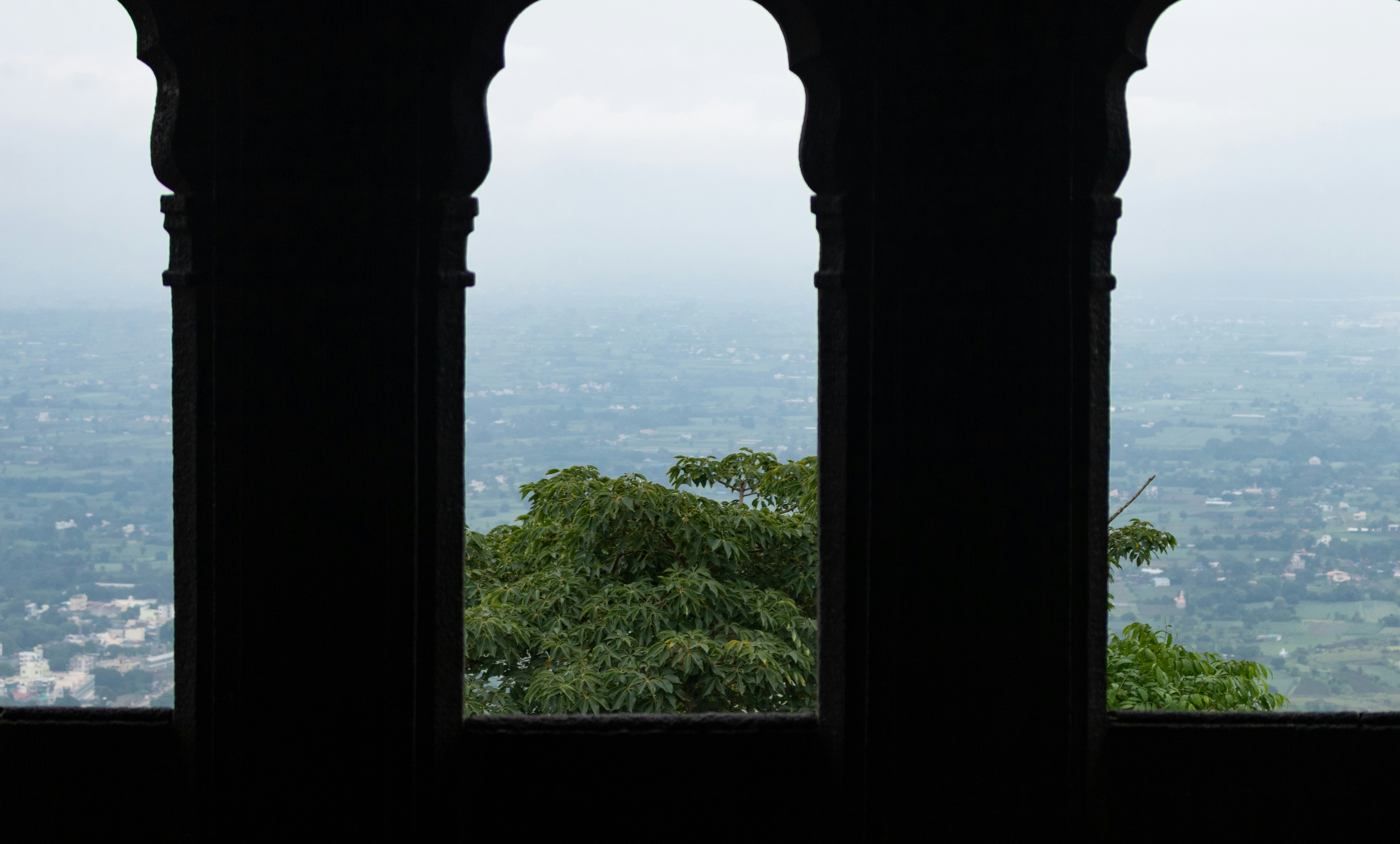 View Through the Arches: Cityscape Framed by Silence