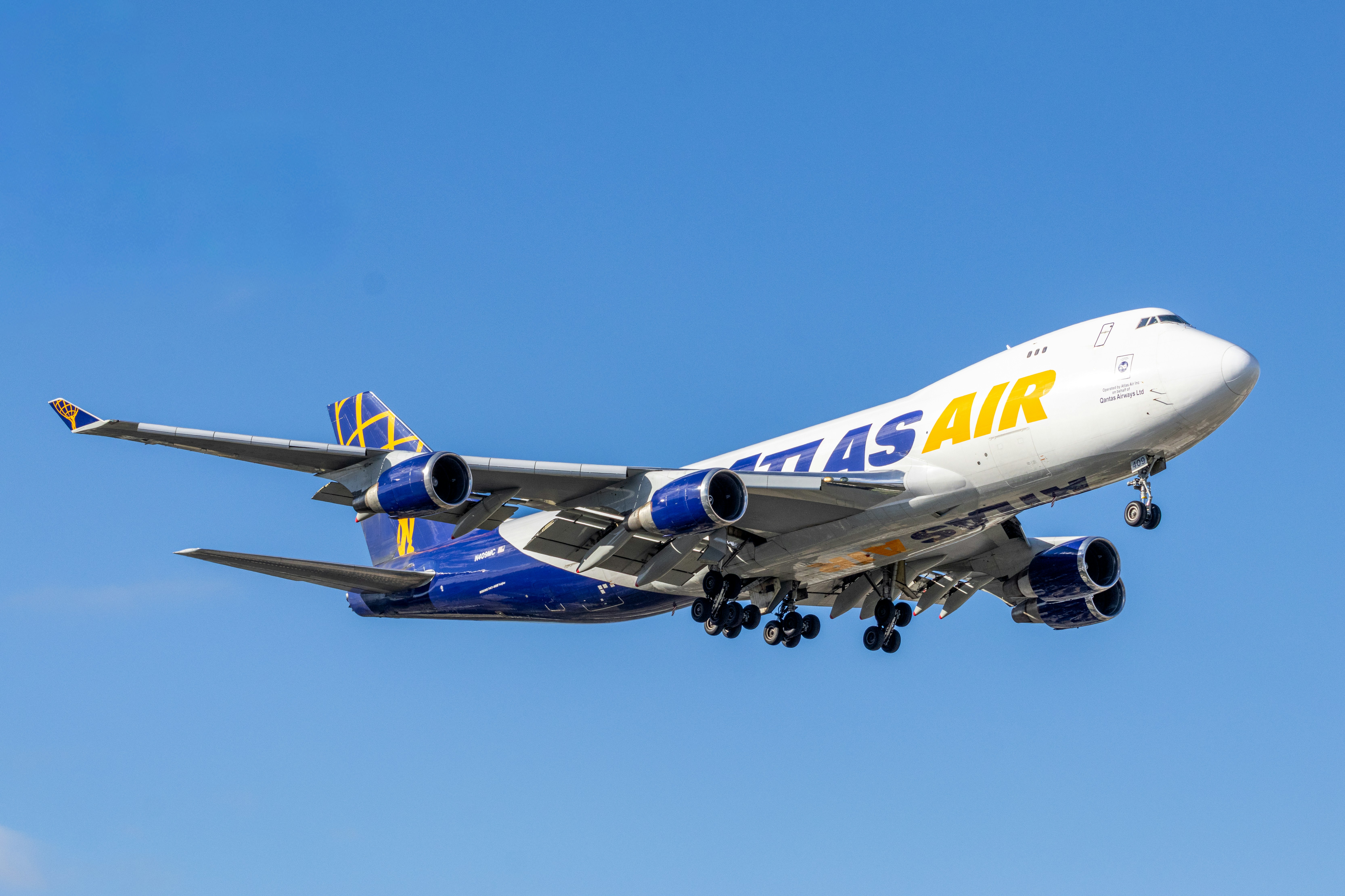 Alexander the Sky: Atlas Air 747 Ascends under Clear Blue