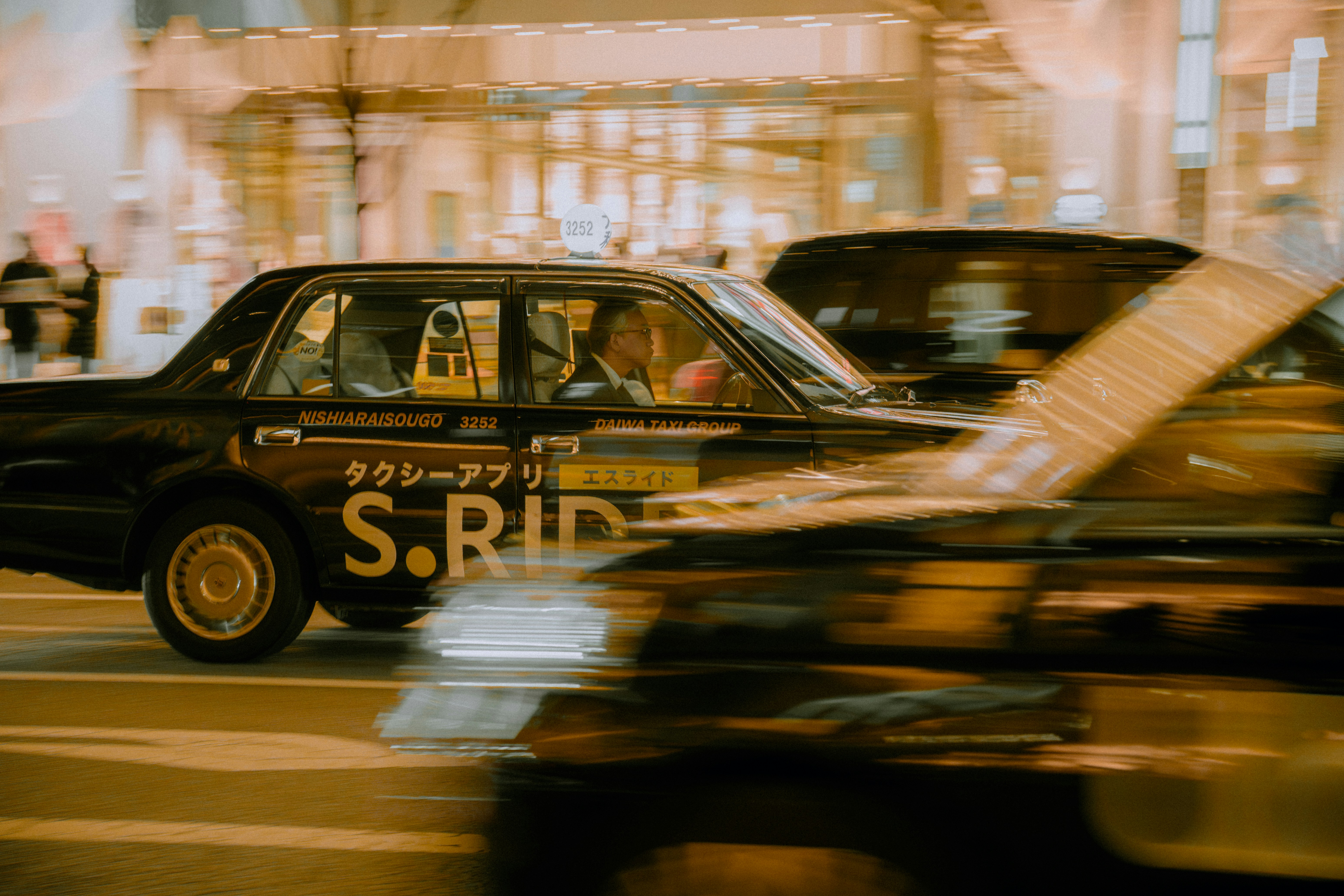 Midnight Taxi in Motion: A Blurred Street Scene