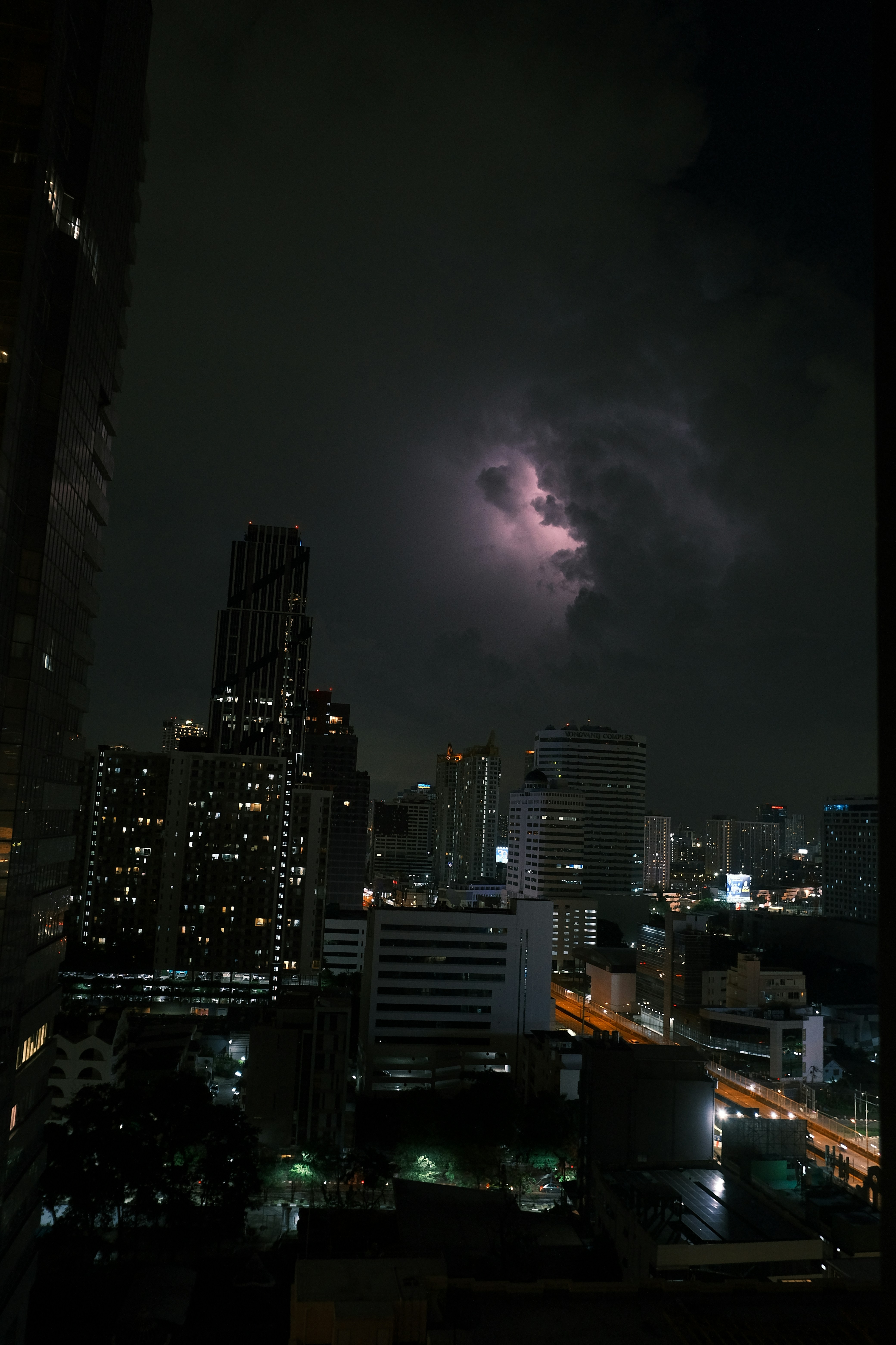 Midnight Thunder Over Glass Towers