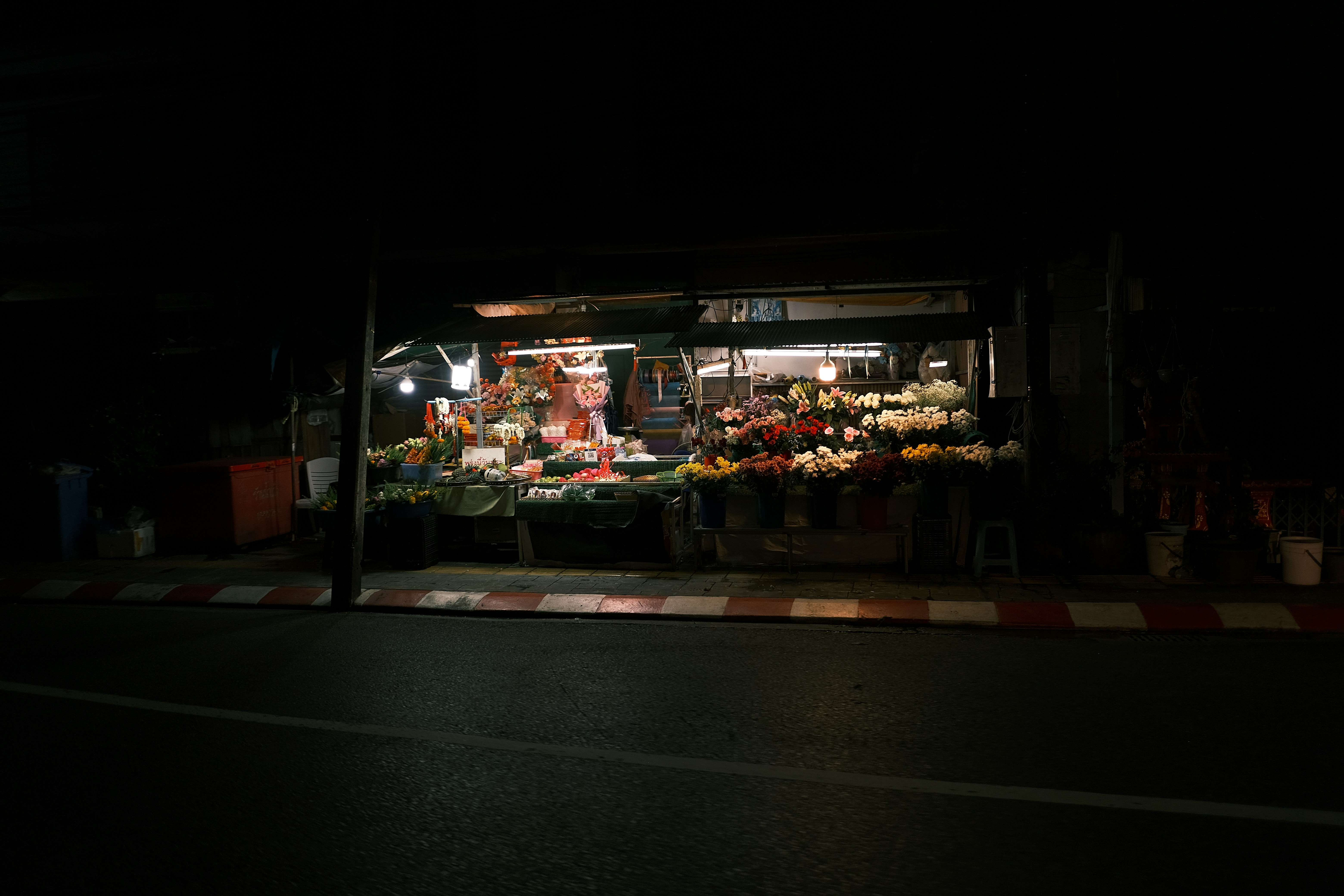 Night Market Stall Glow: Flowers and Fruit Under Streetlight