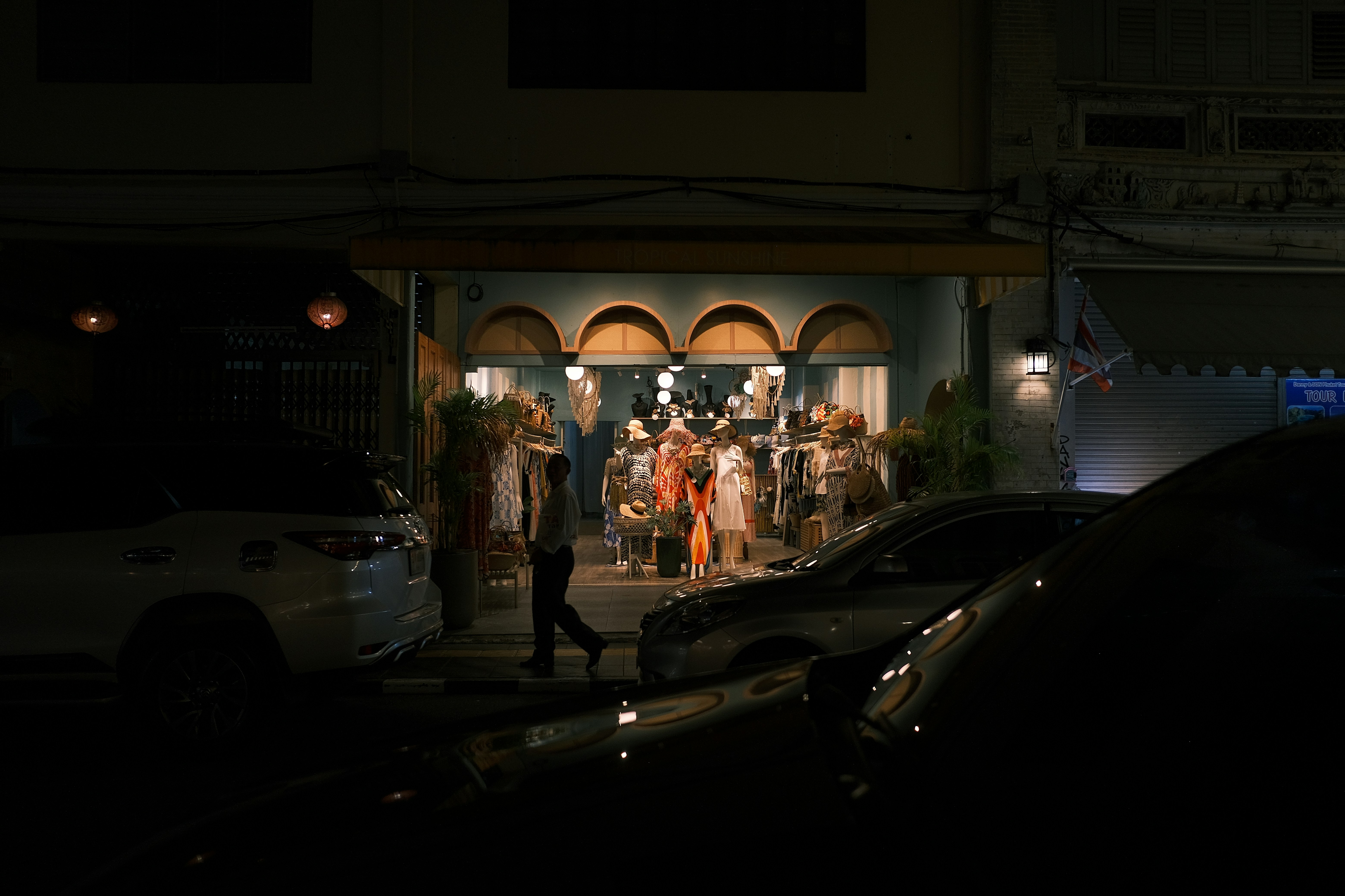 Neon Boutique Amid Quiet Traffic: Nightlife in a Small Street